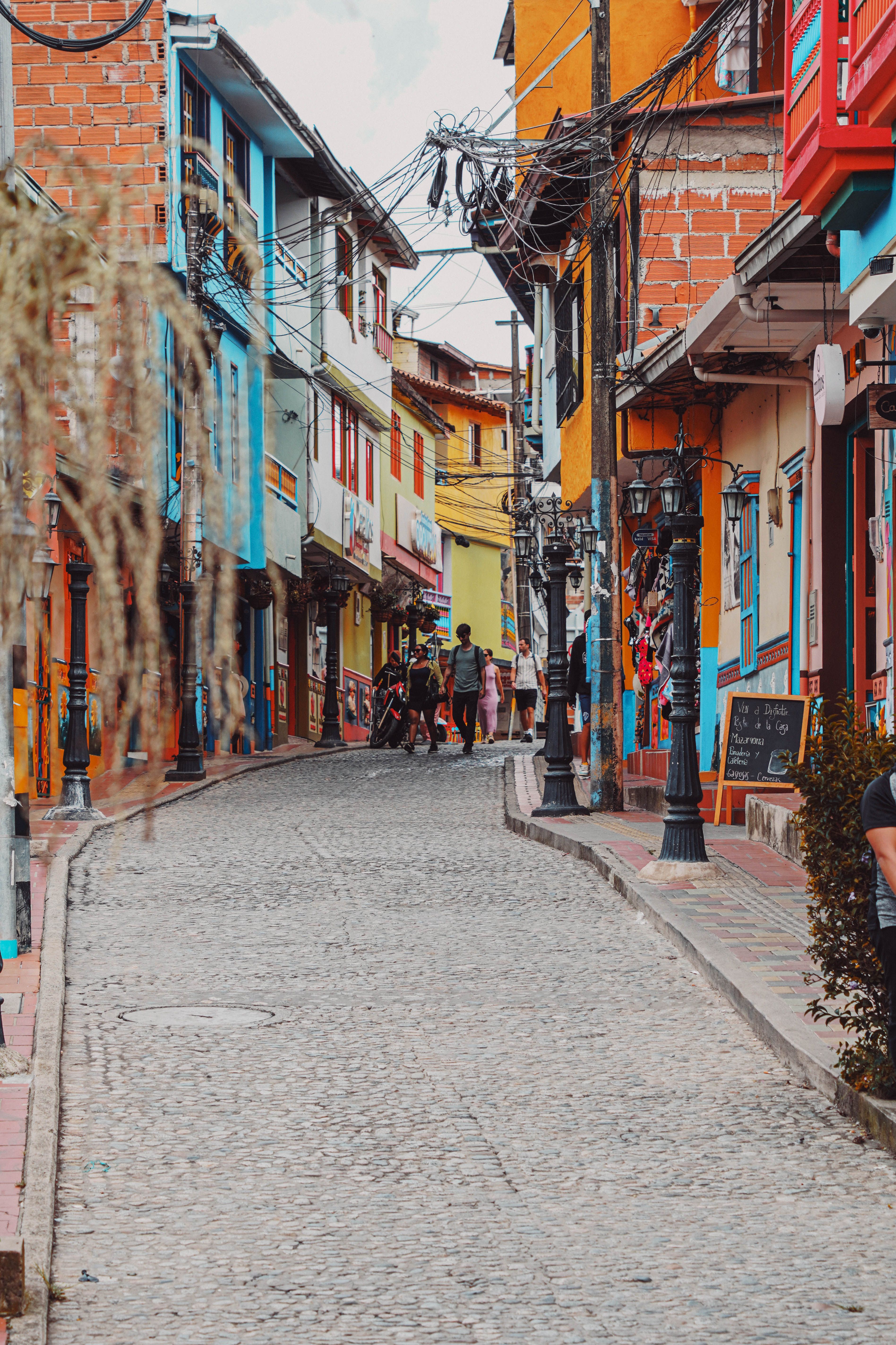 Vibrant Street Scene in Colorful Urban Neighborhood · Free Stock Photo