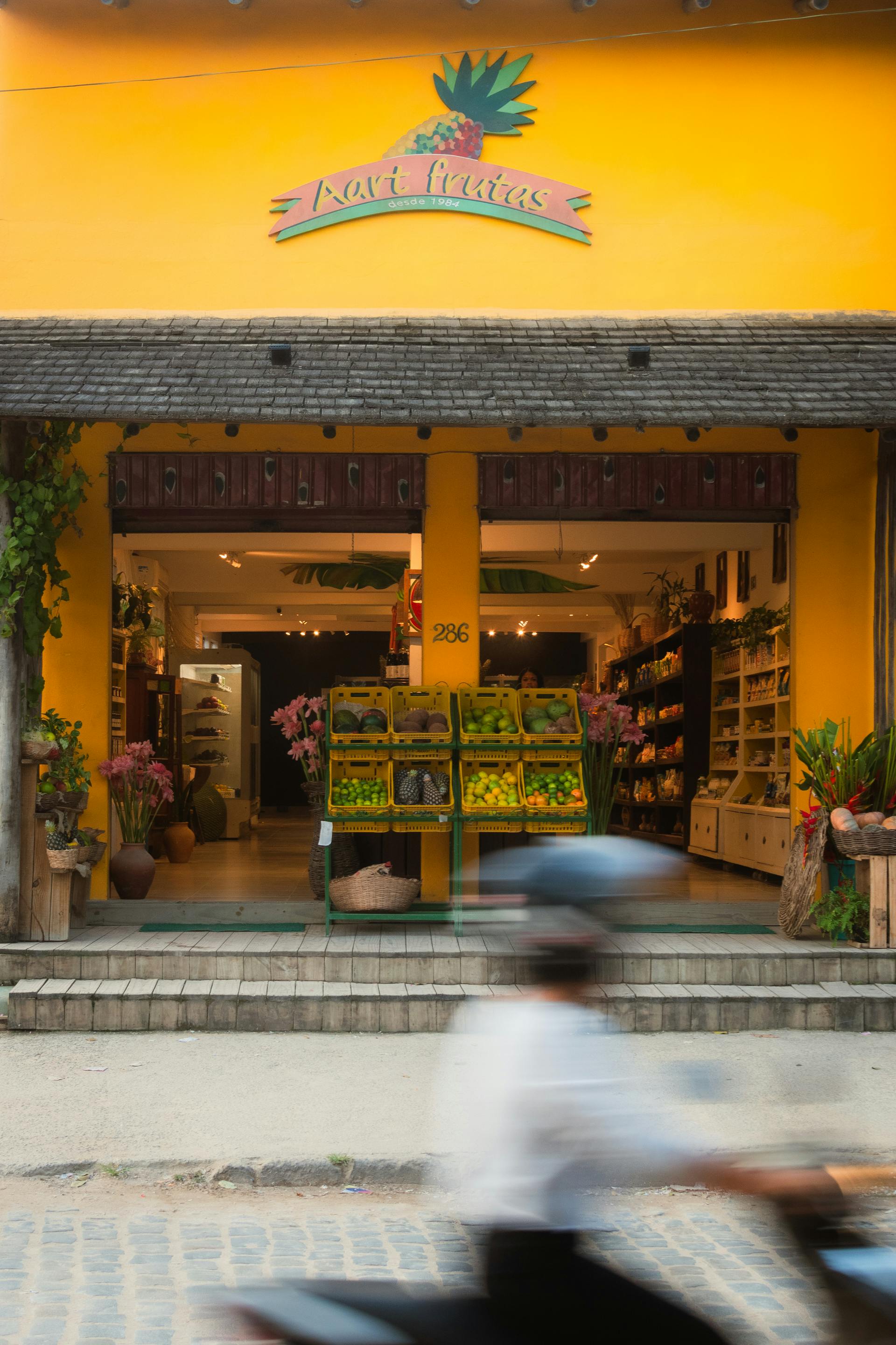 Vibrant Fruit Storefront in Bustling Street · Free Stock Photo