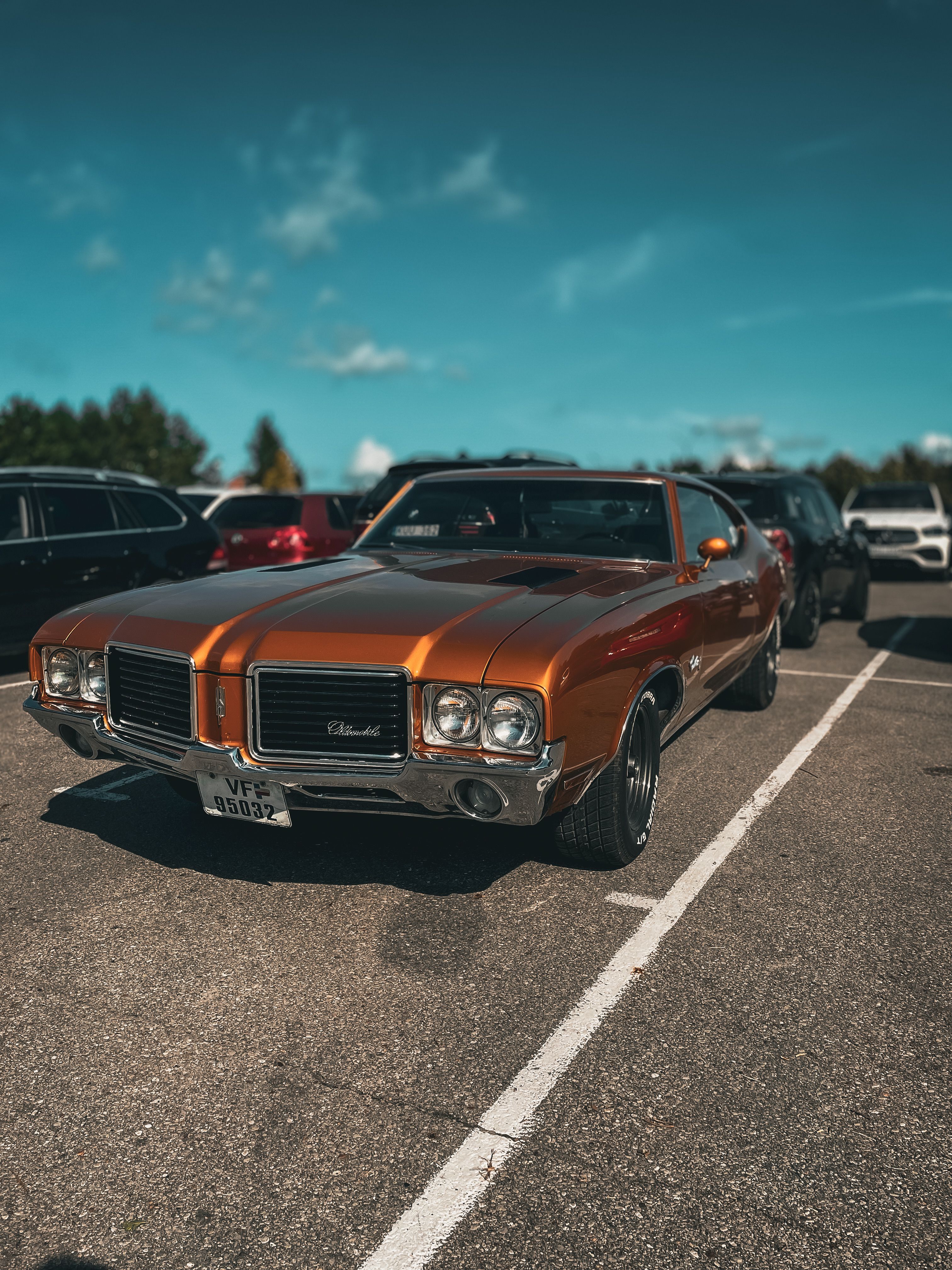 Vintage Orange Classic Car in Parking Lot · Free Stock Photo