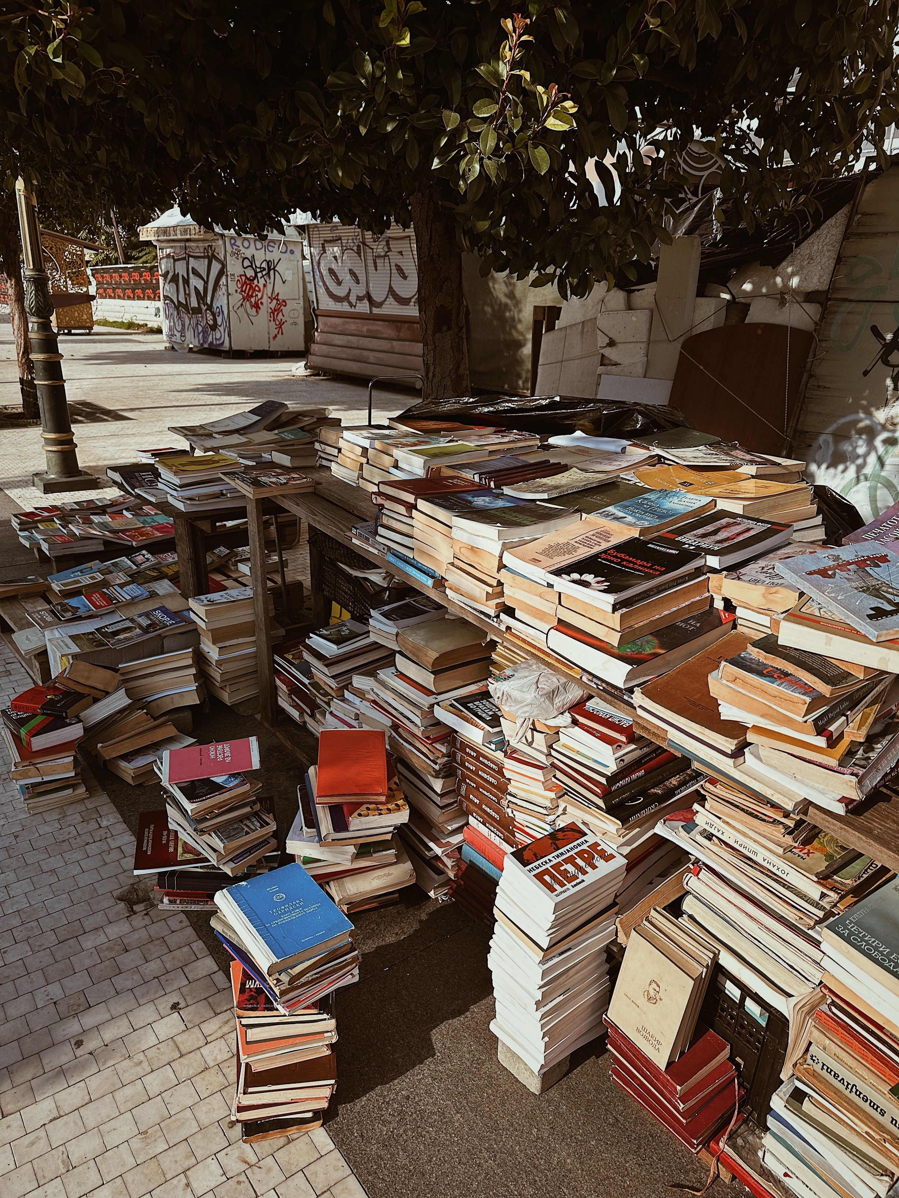Outdoor book market with stacks of used books · Free Stock Photo
