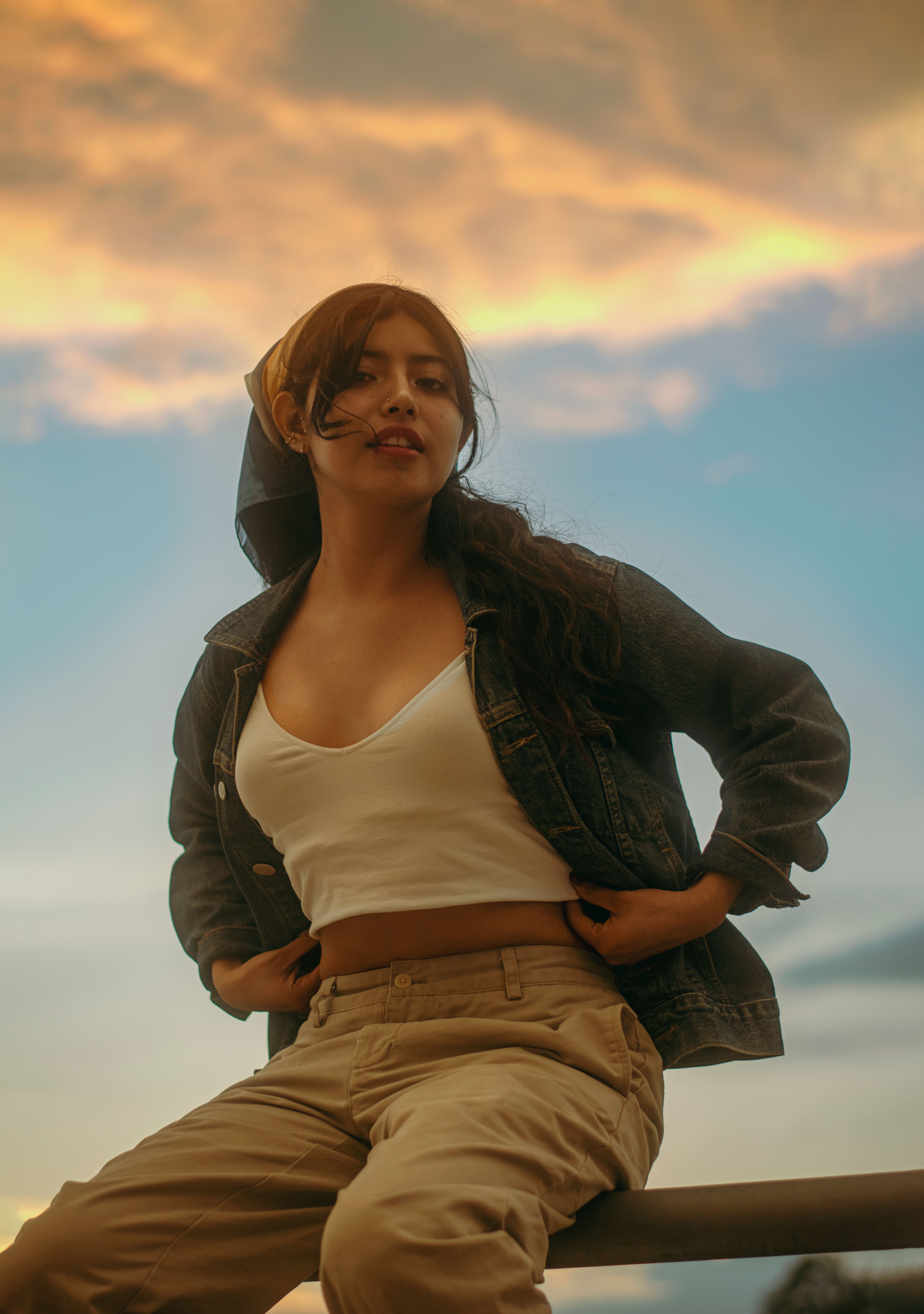 Confident Woman Posing at Twilight Outdoors · Free Stock Photo