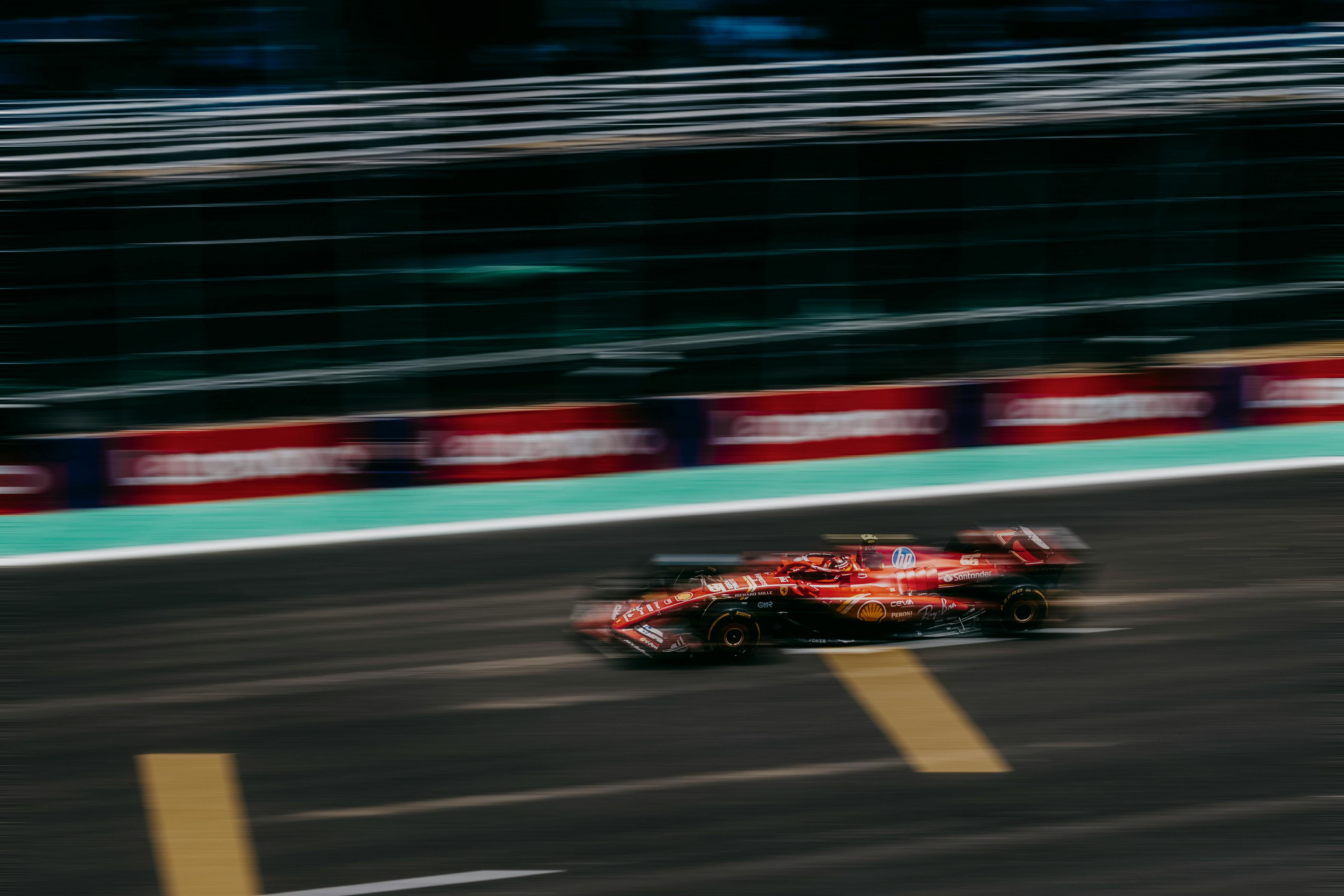 High-Speed Racing Car on Track at Daytime · Free Stock Photo