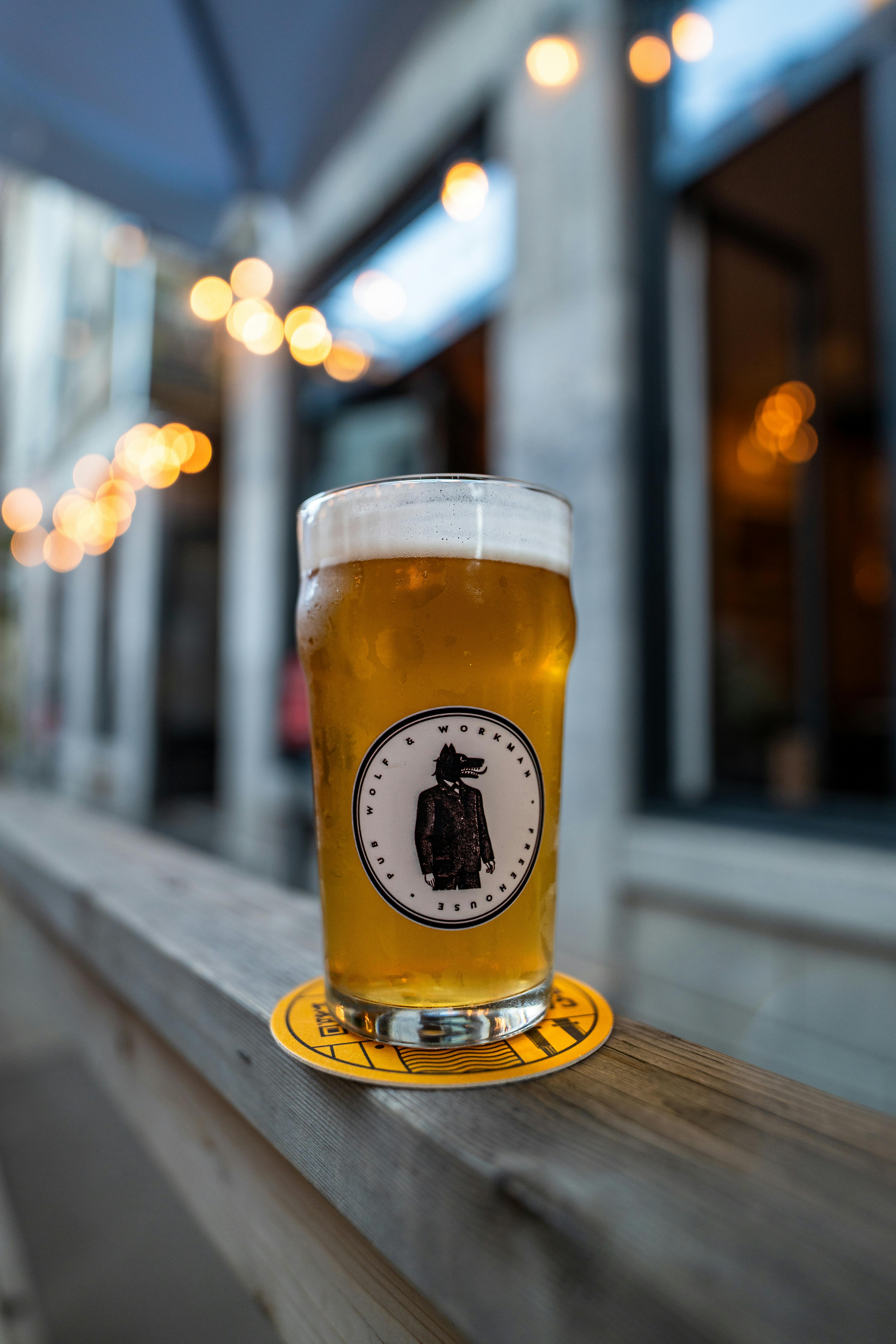 Pint of Golden Craft Beer on Outdoor Patio · Free Stock Photo