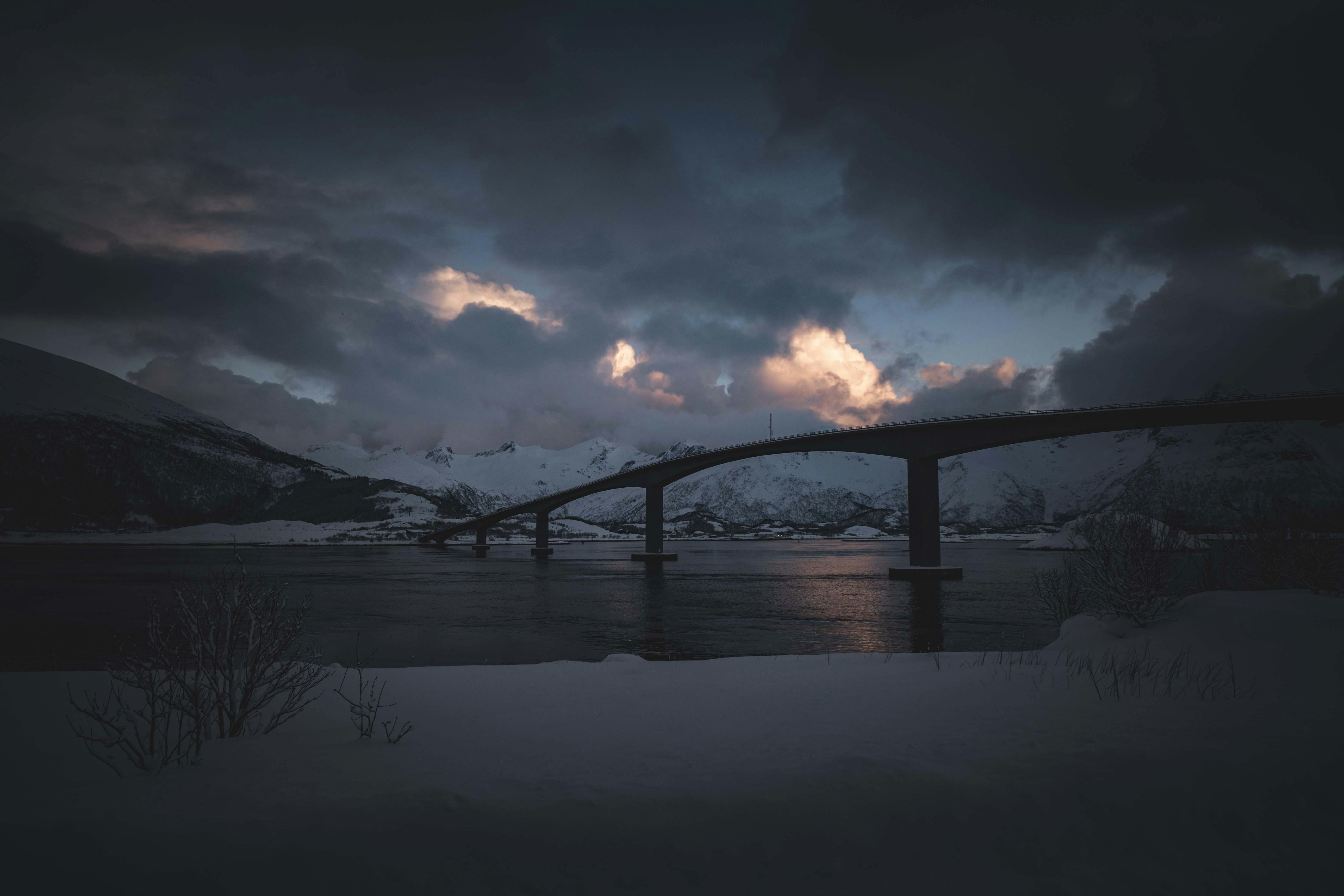 Moody Bridge Over Snowy Landscape at Twilight · Free Stock Photo