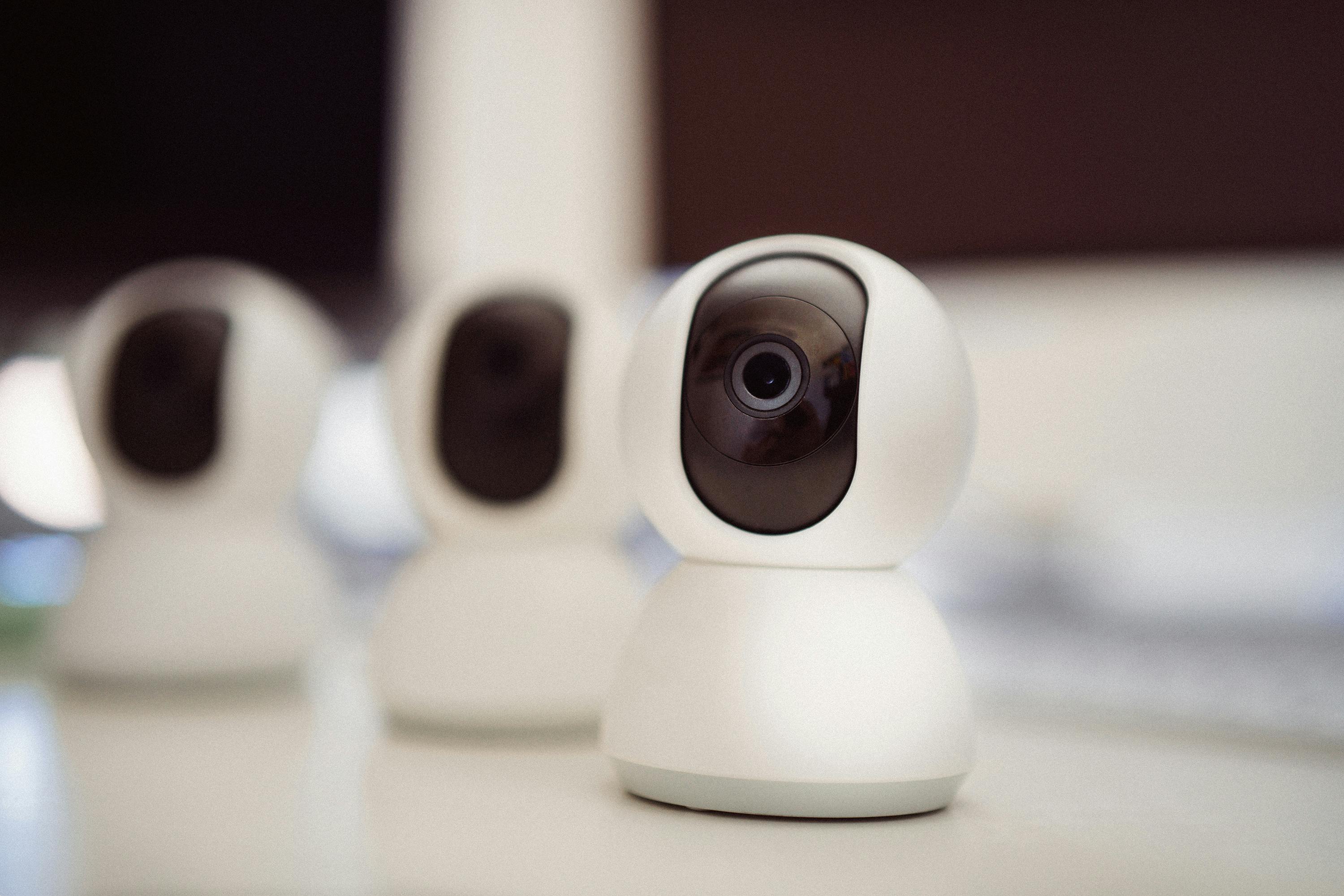 Modern Smart Home Security Cameras on Desk · Free Stock Photo