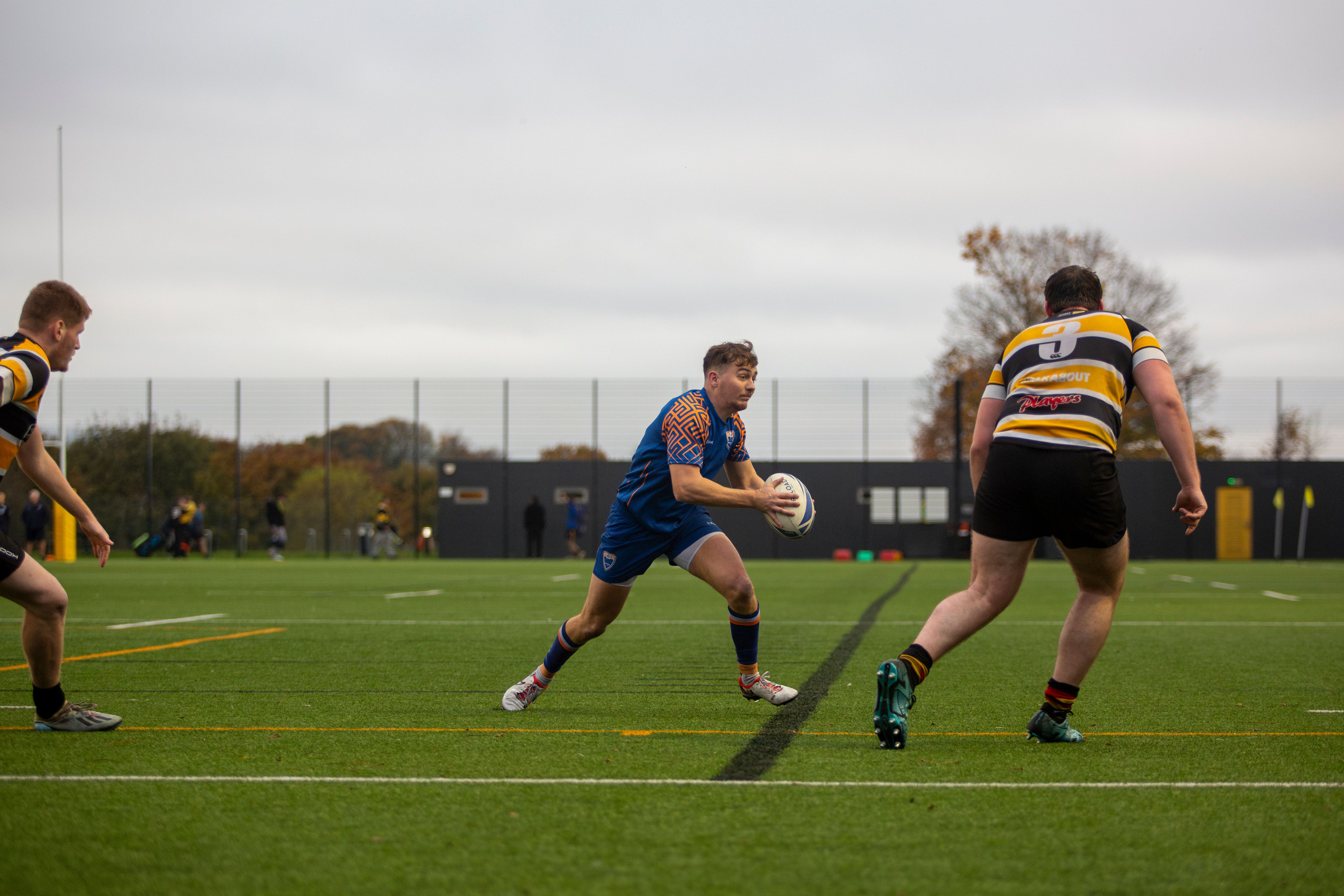 College Rugby Match on Green Field · Free Stock Photo