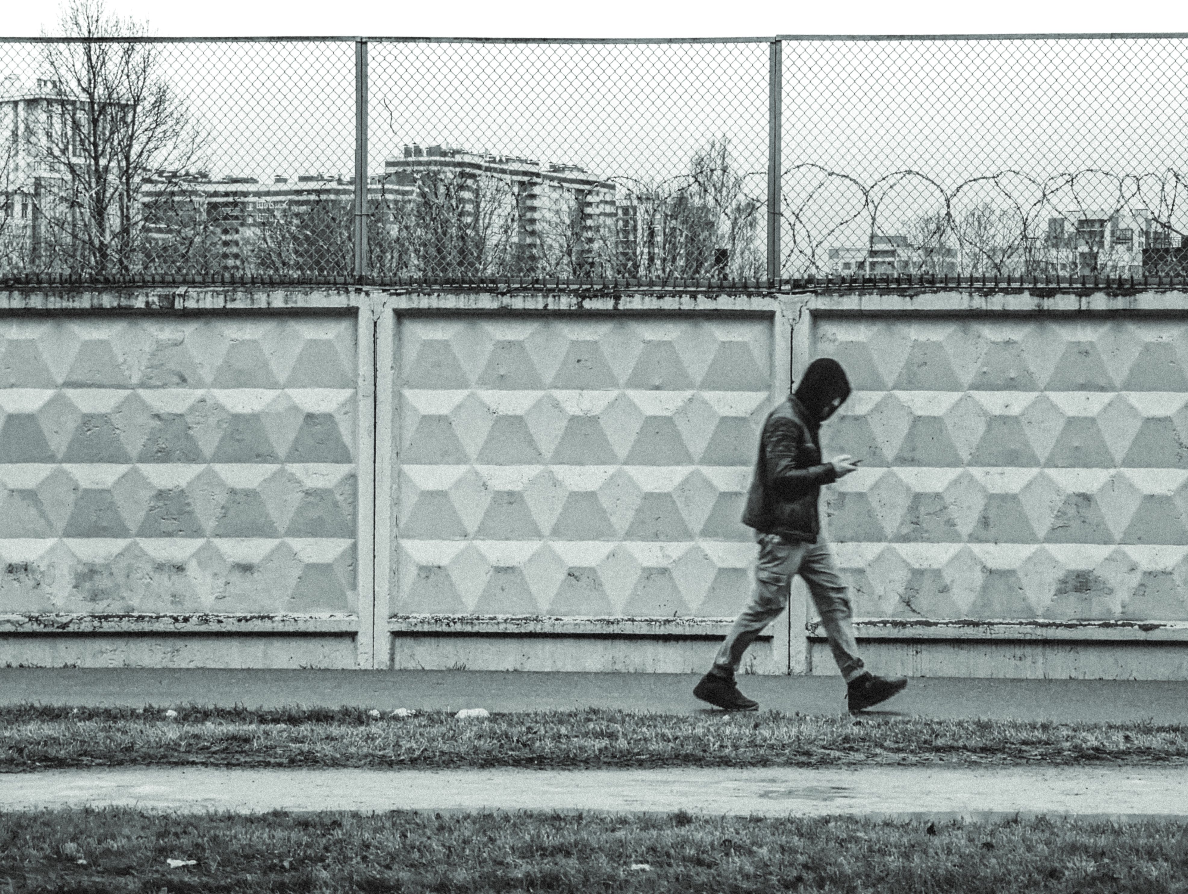 Urban Walkway with Person in Monochrome Scene · Free Stock Photo