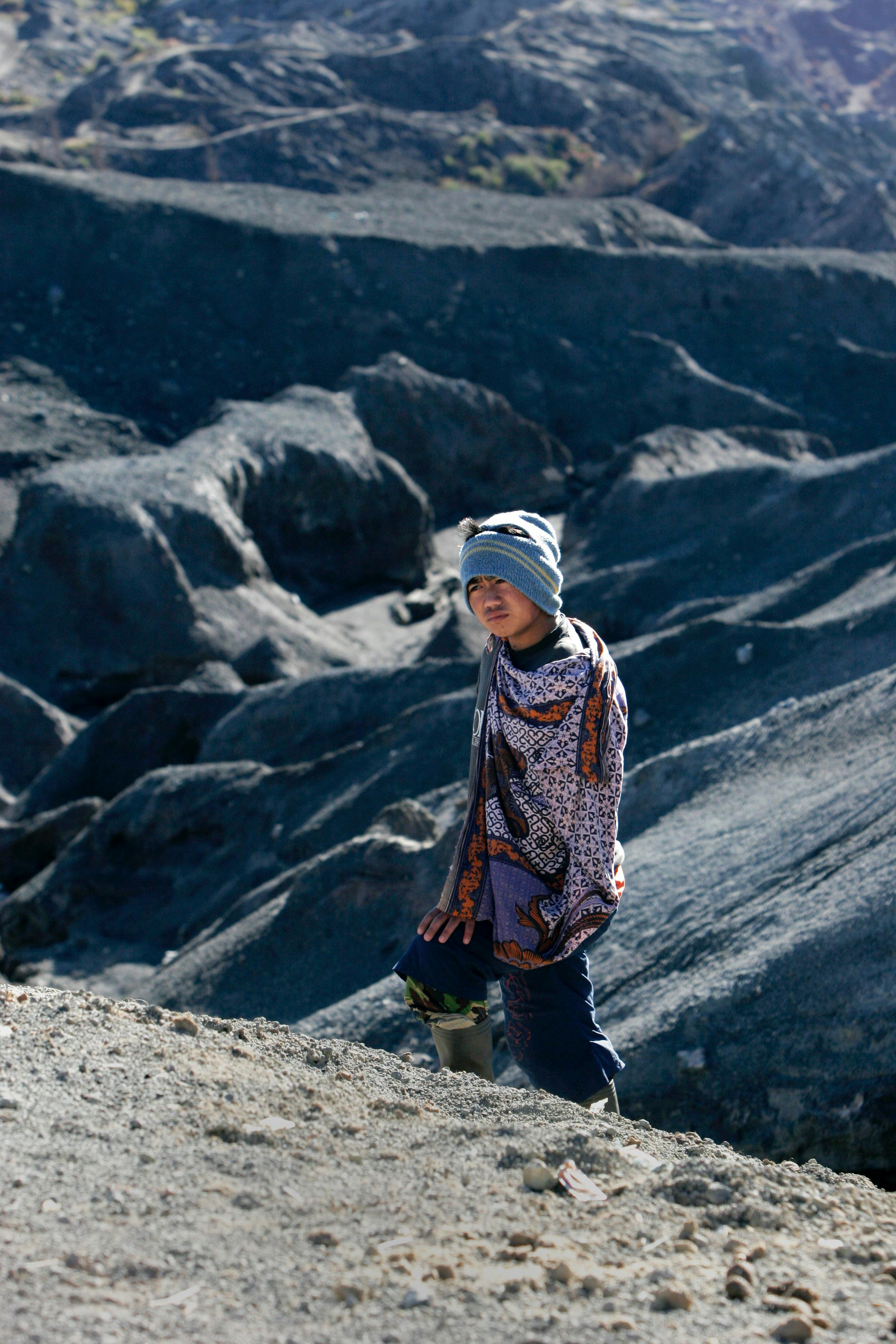 Young Child Exploring Rugged Mountain Terrain · Free Stock Photo