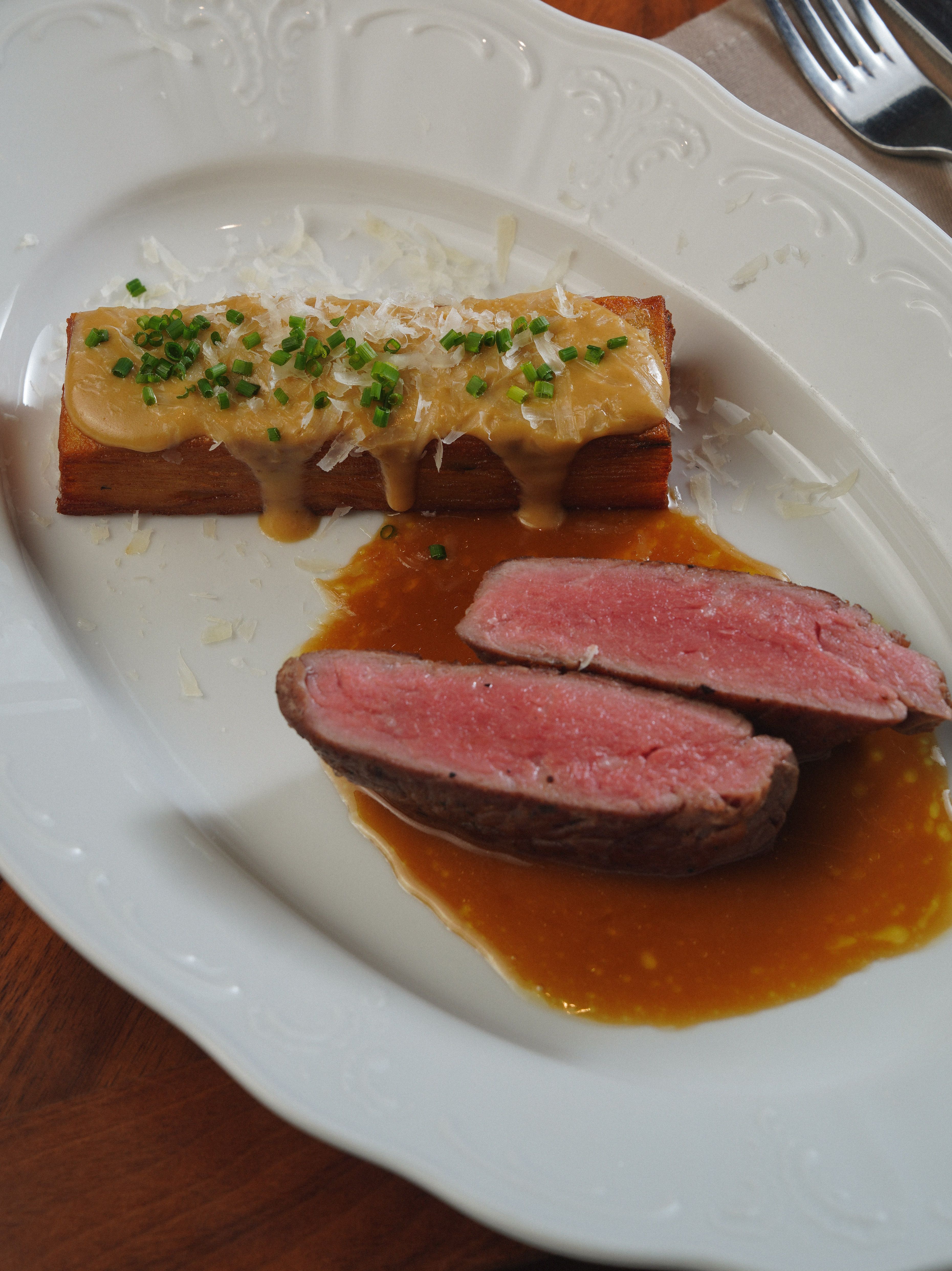 Gourmet Beef with Potato Stack on Elegant Plate · Free Stock Photo