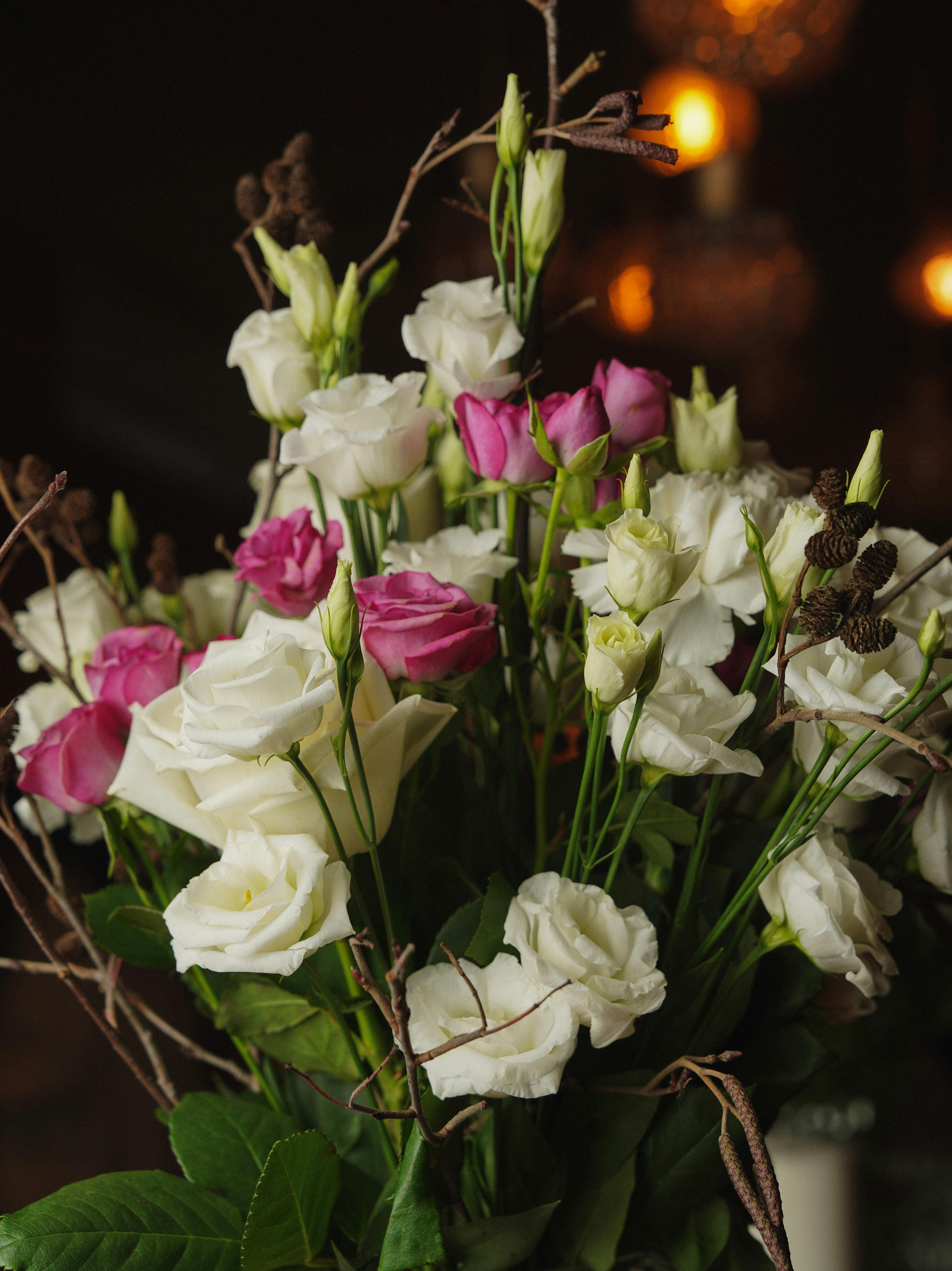 Elegant Bouquet of Lisianthus Flowers in Dim Lighting · Free Stock Photo