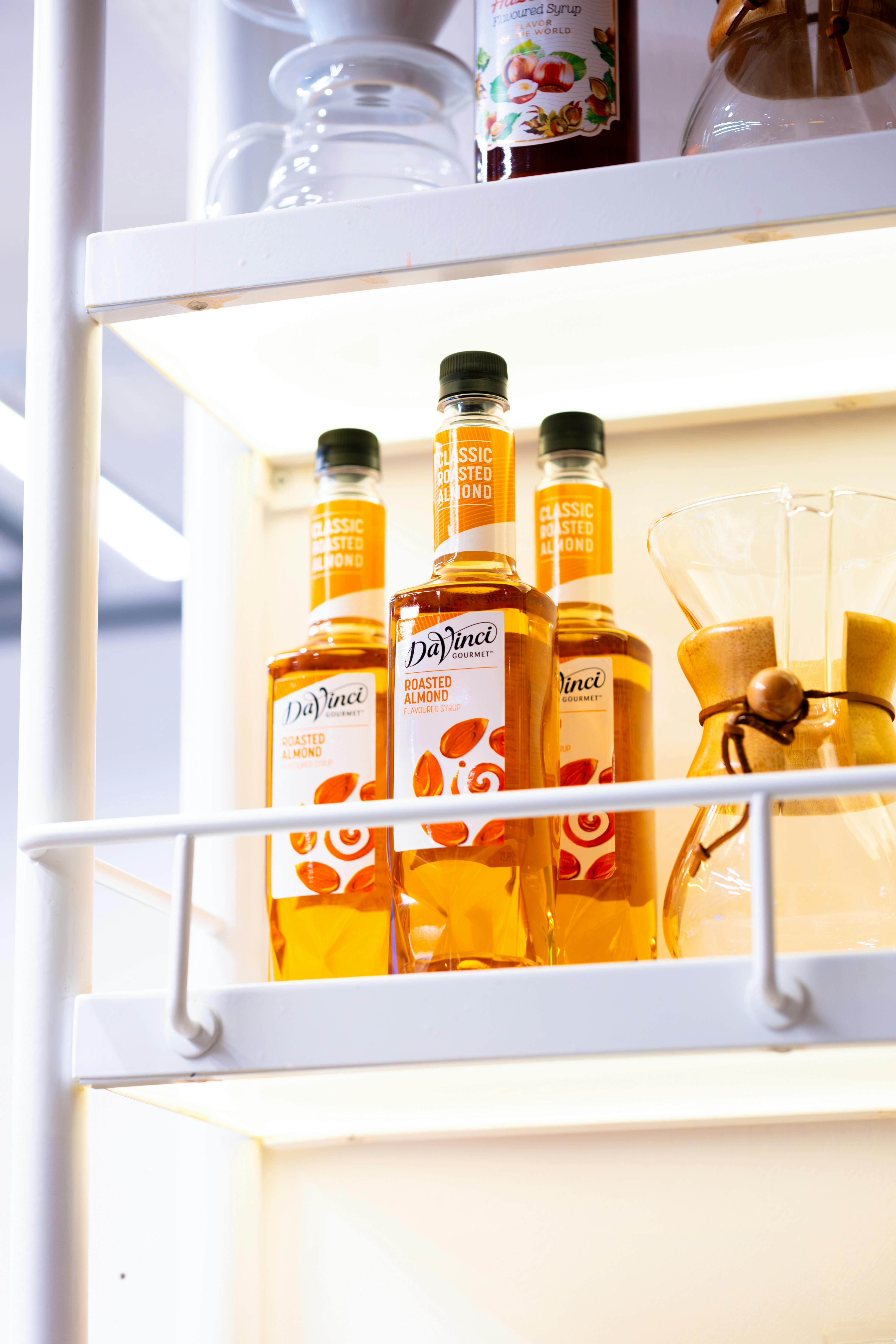 Bottles of DaVinci Syrup on Shelf · Free Stock Photo