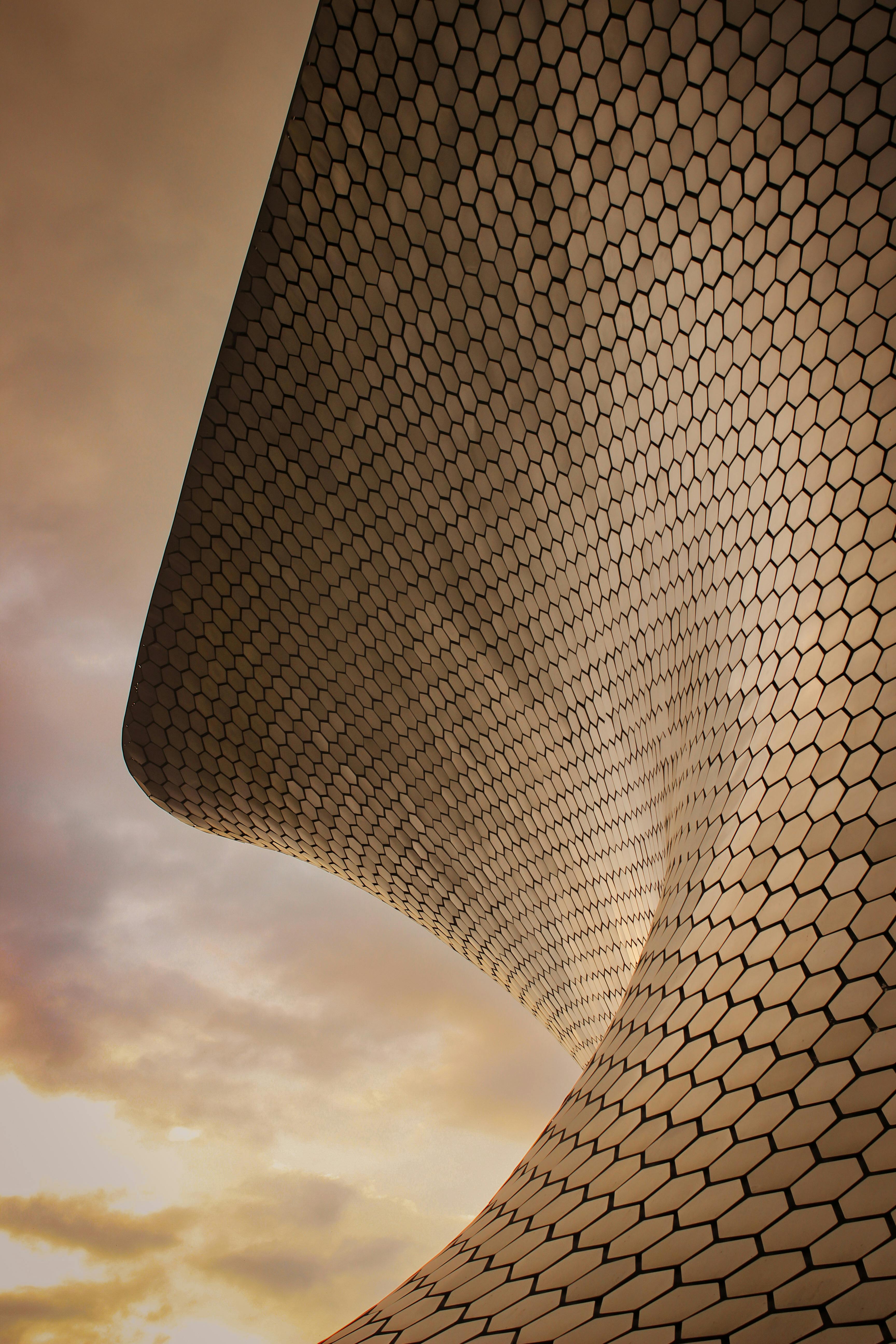 Modern architectural design with honeycomb facade · Free Stock Photo