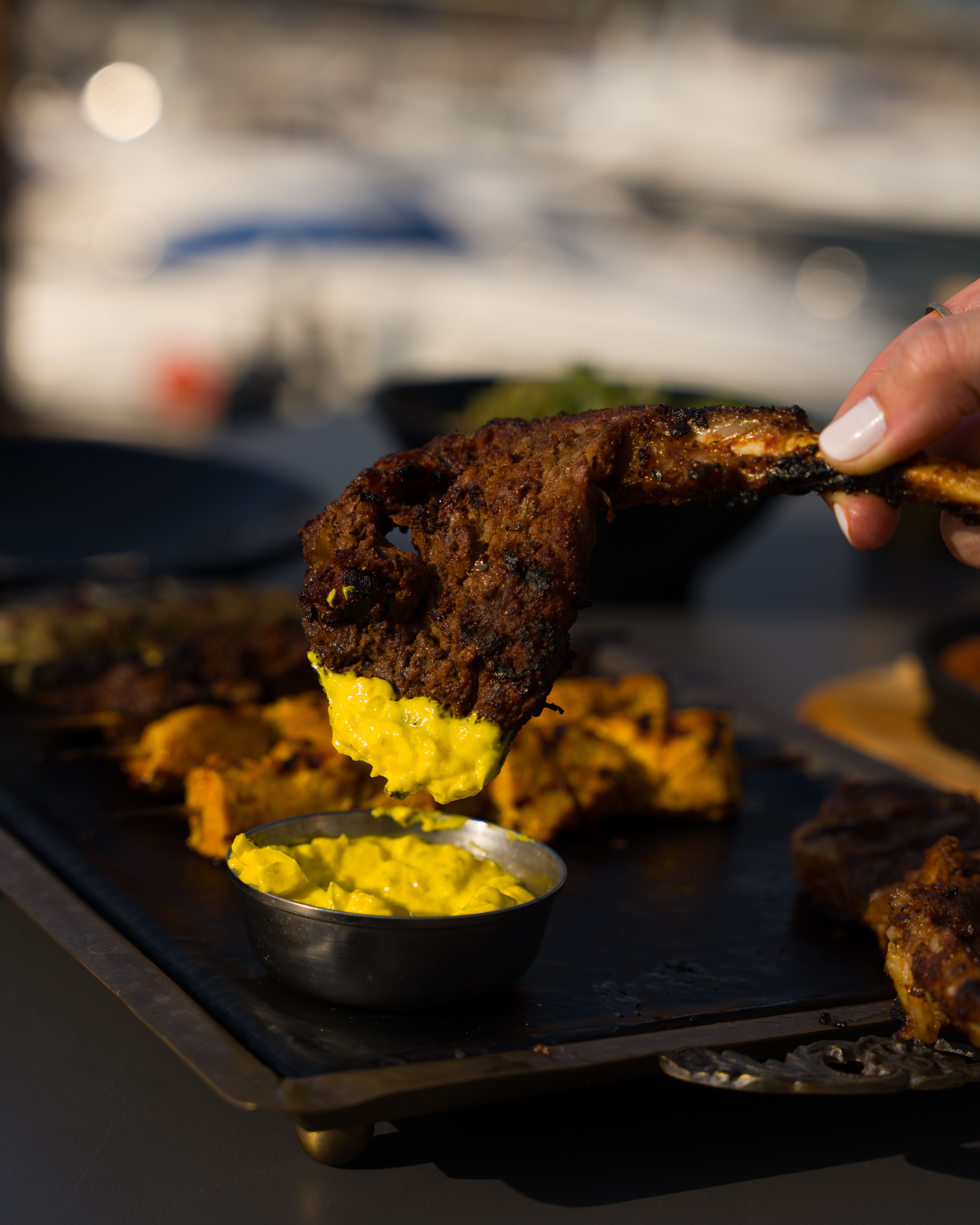 Close-up of Grilled Meat with Mustard Sauce · Free Stock Photo