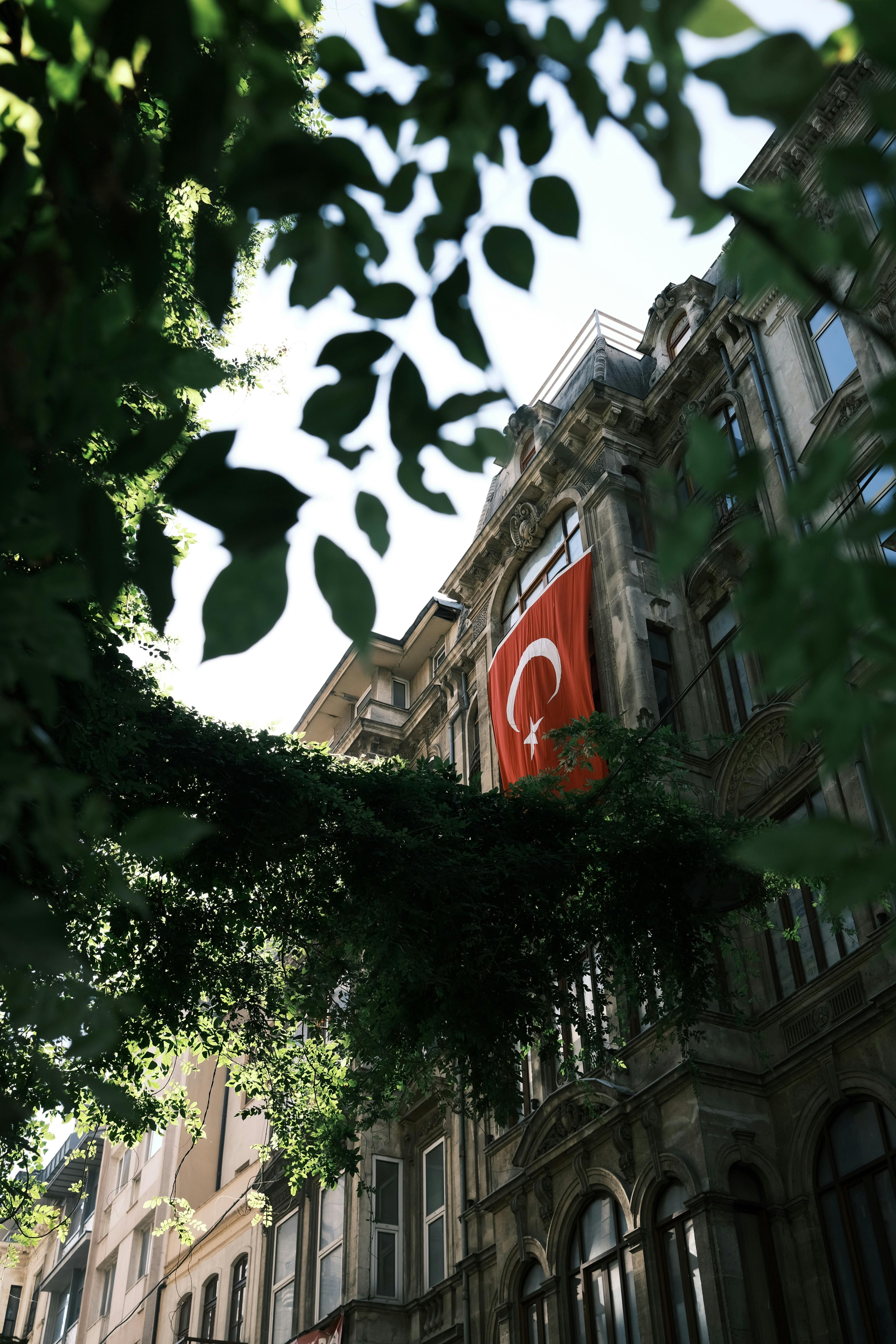 Historic Istanbul Building with Turkish Flag · Free Stock Photo