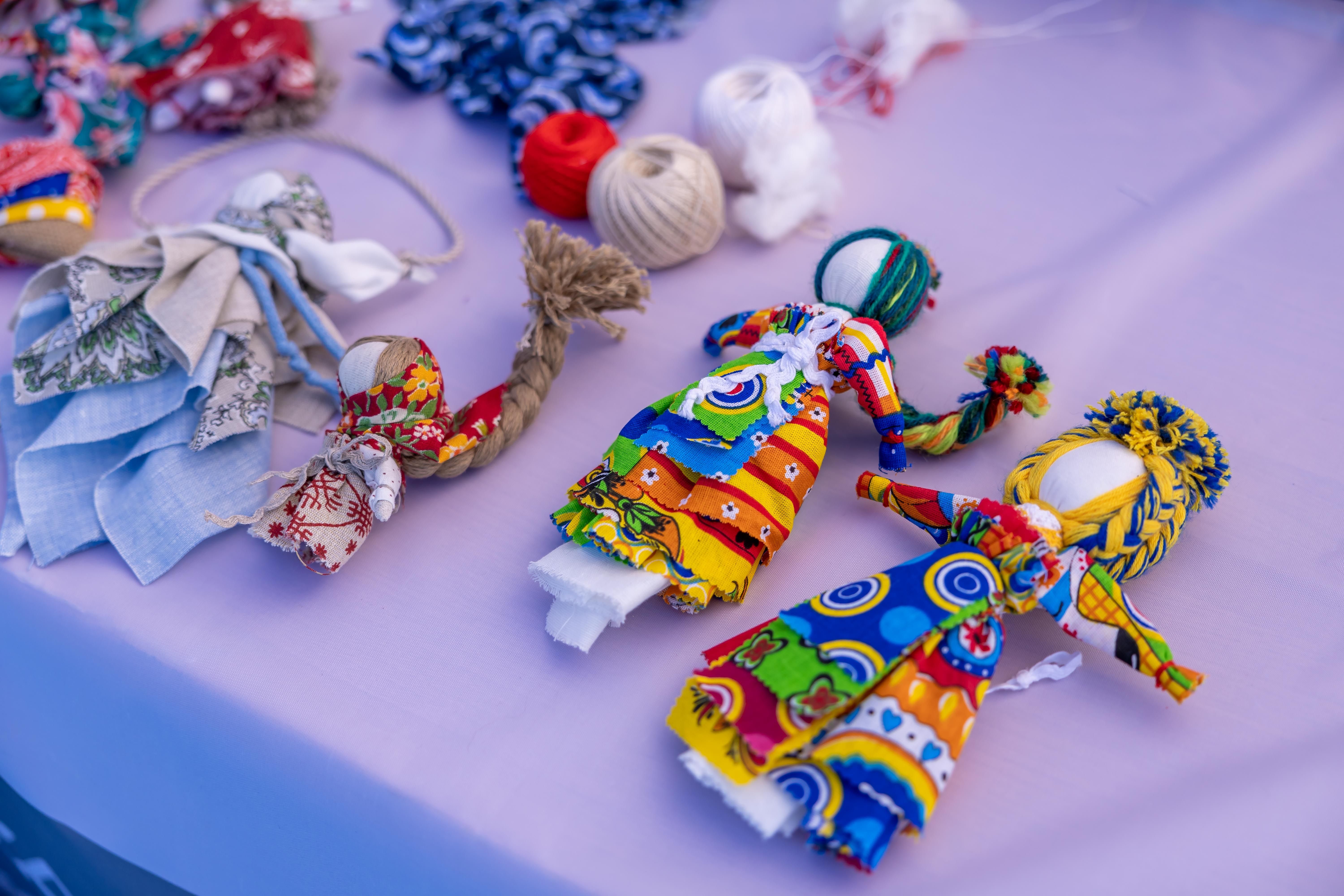 Colorful Handcrafted Dolls on Display · Free Stock Photo