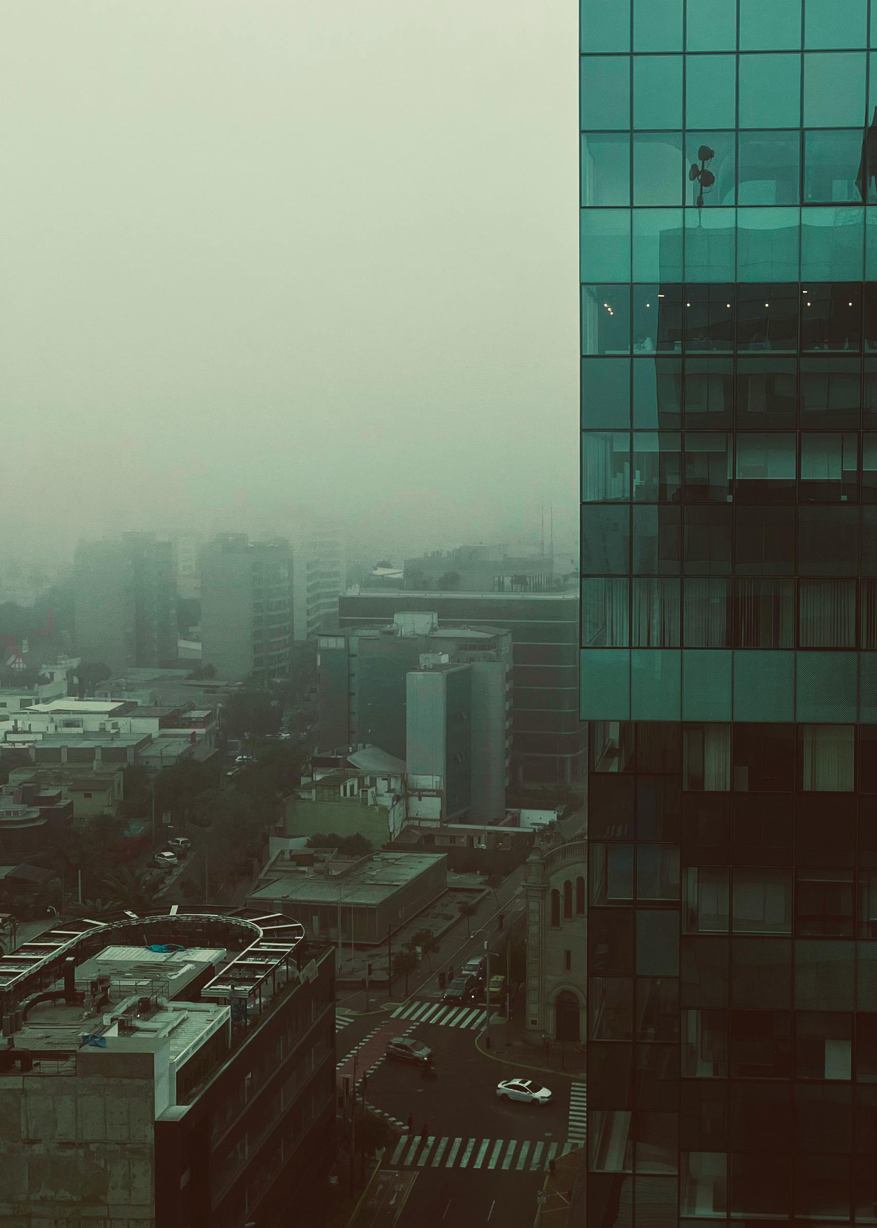 Foggy Cityscape of Modern Skyscrapers in Lima · Free Stock Photo