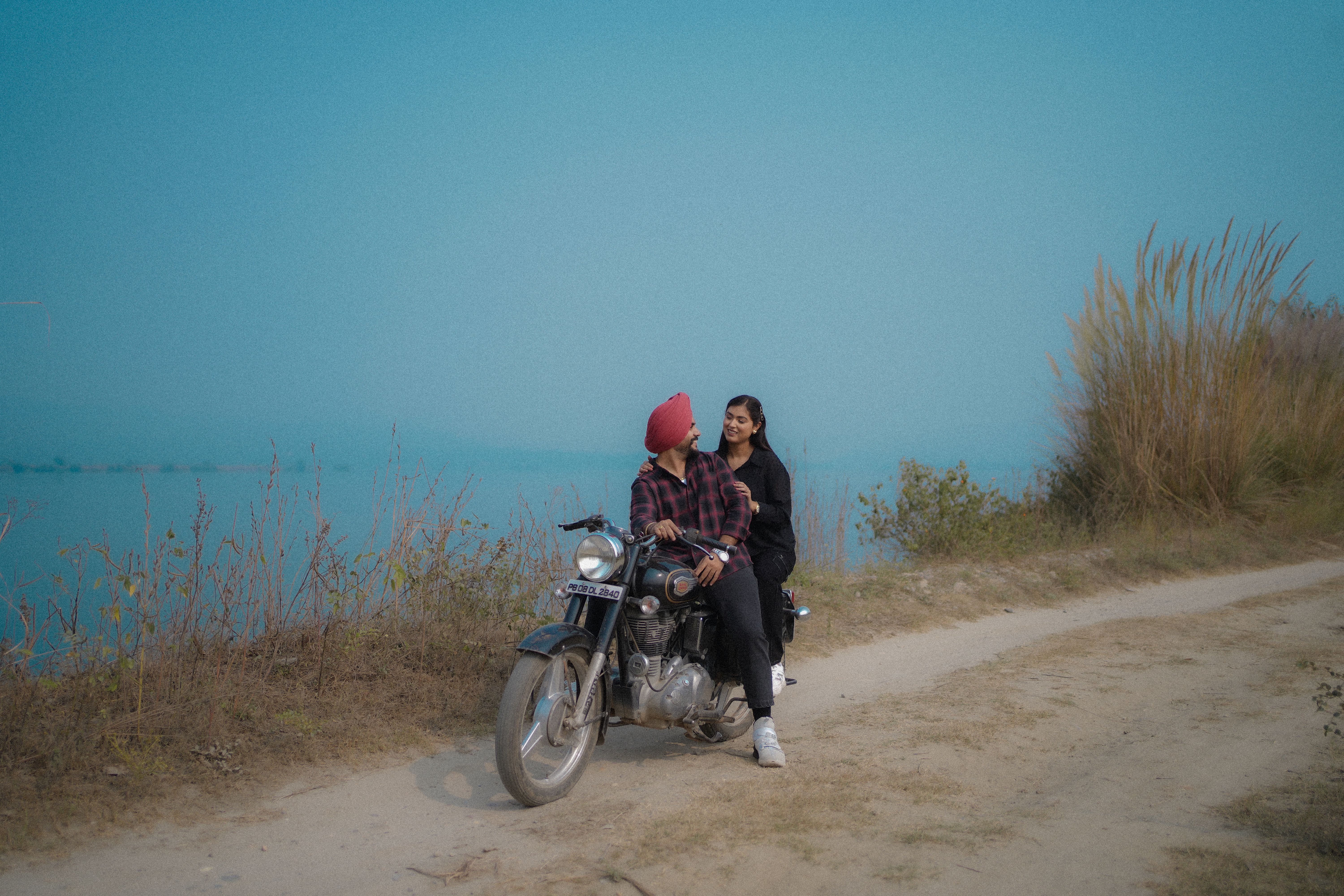 Couple Enjoying Motorcycle Ride by Lakeside · Free Stock Photo