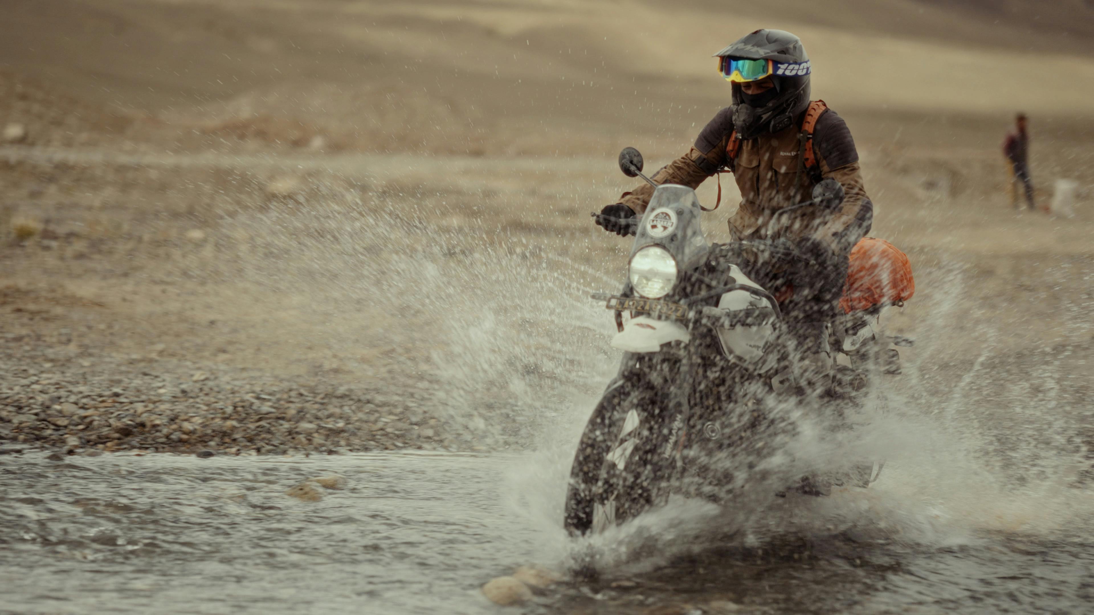 Adventure Motorcyclist Traversing Water Crossing · Free Stock Photo