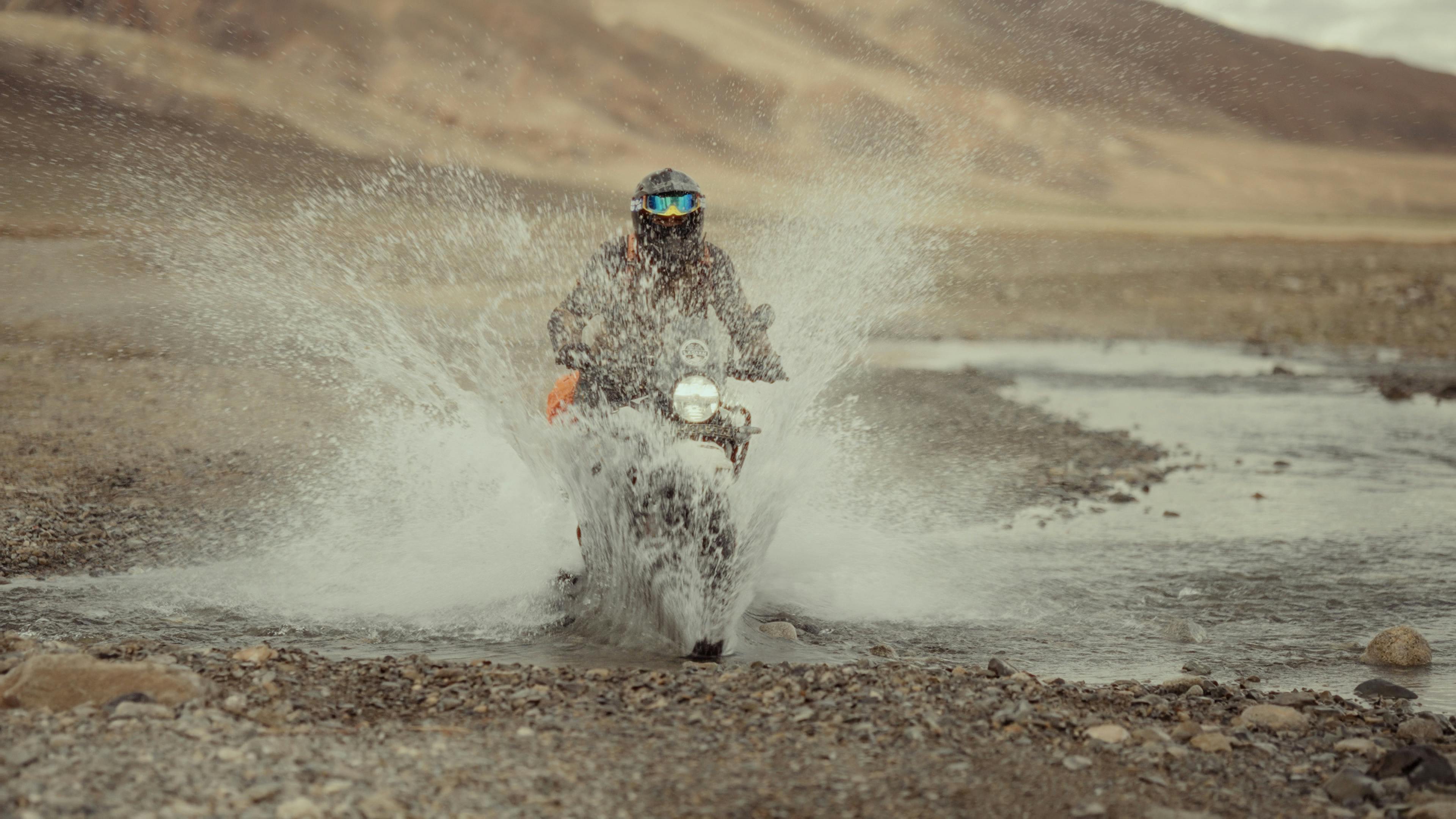 Adventurous Motorcycle Ride Through Water Stream · Free Stock Photo