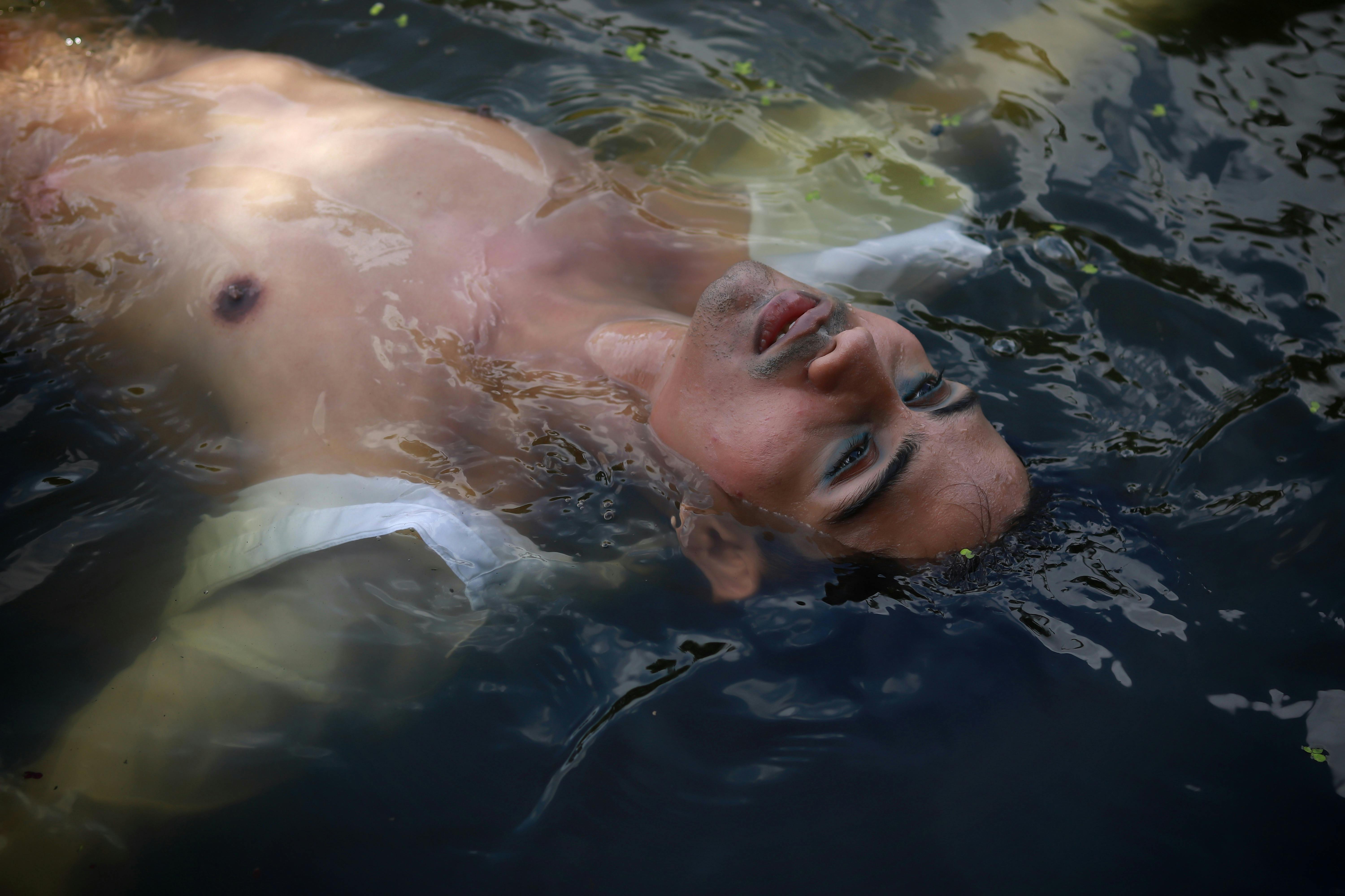 Relaxing Man Floating in Water Outdoors · Free Stock Photo
