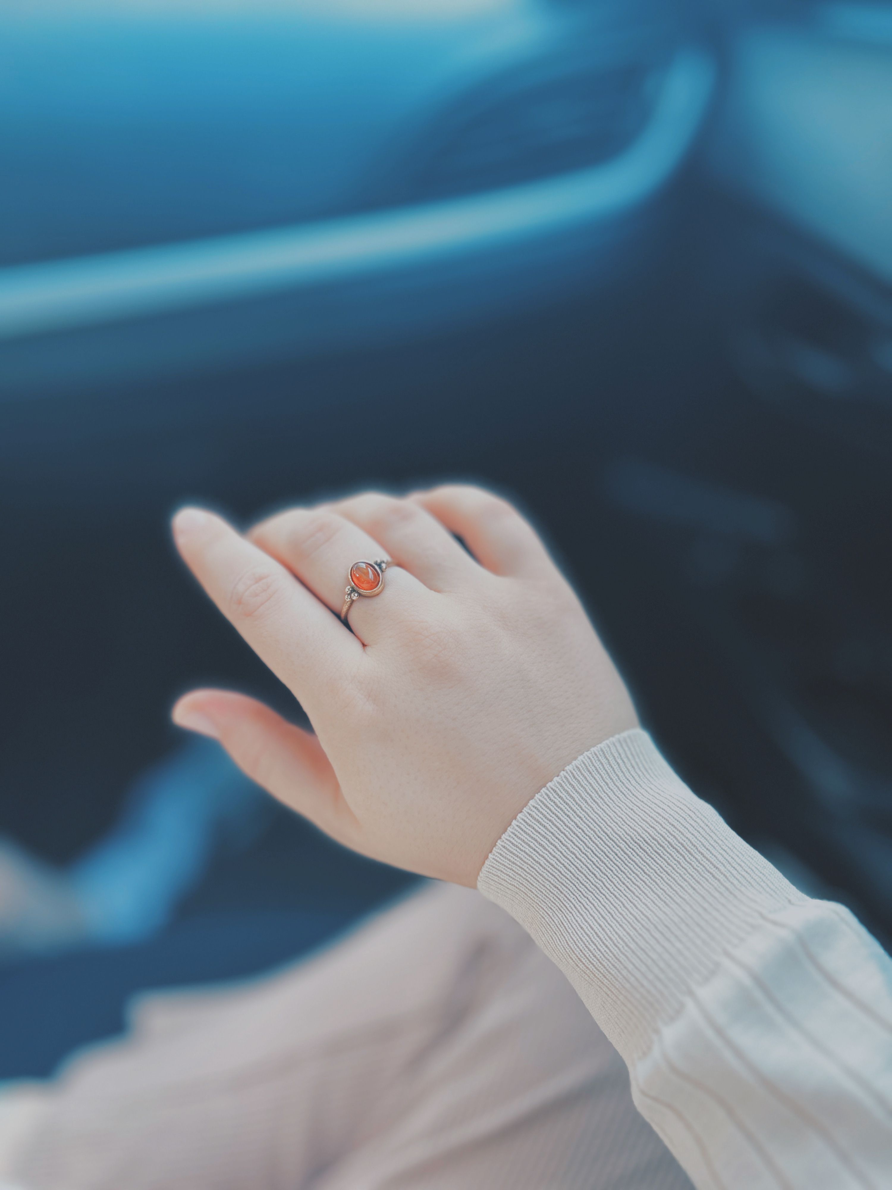 Close-Up of Hand Showing Elegant Ring Inside Car · Free Stock Photo