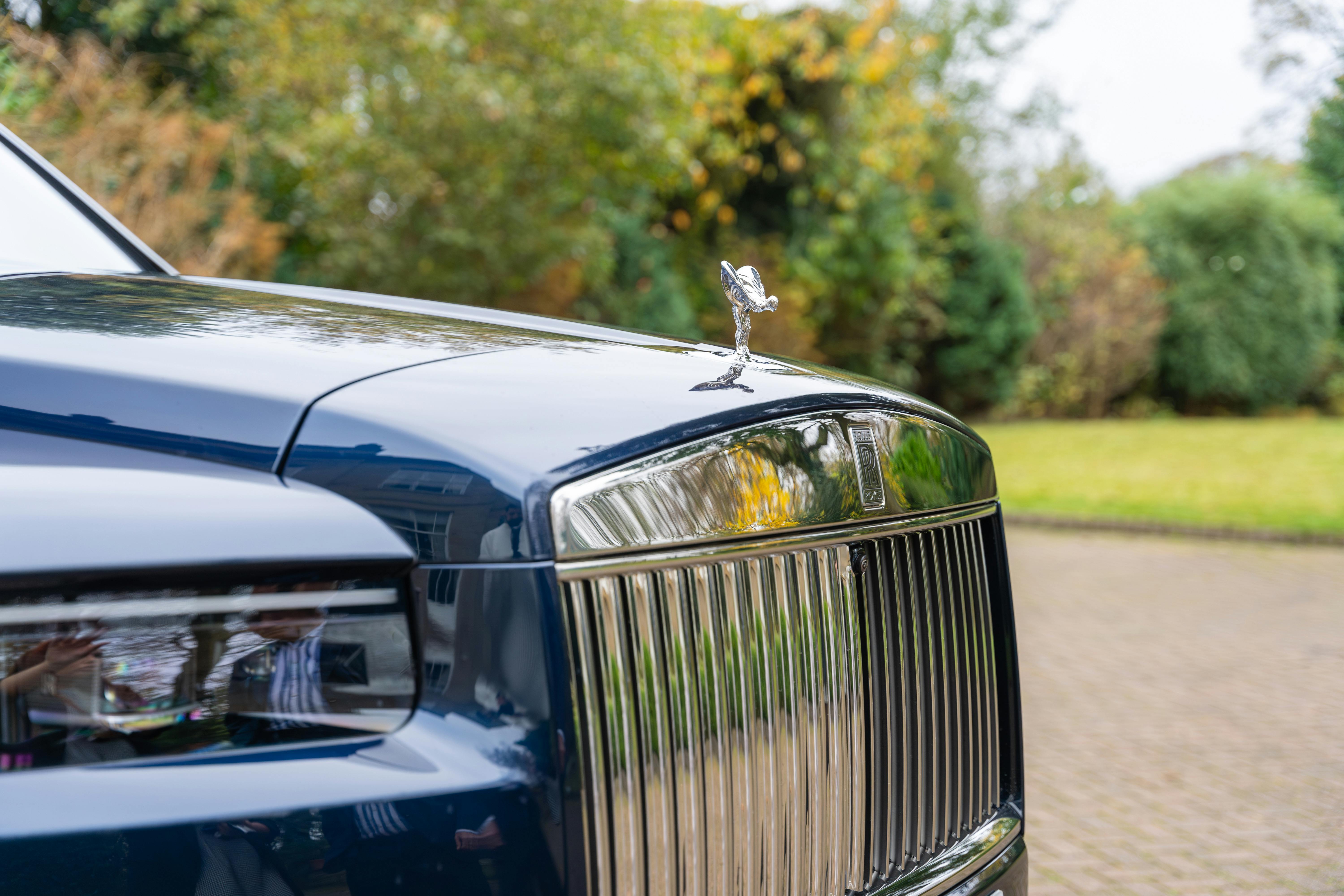 Luxury Car Front View with Iconic Emblem · Free Stock Photo