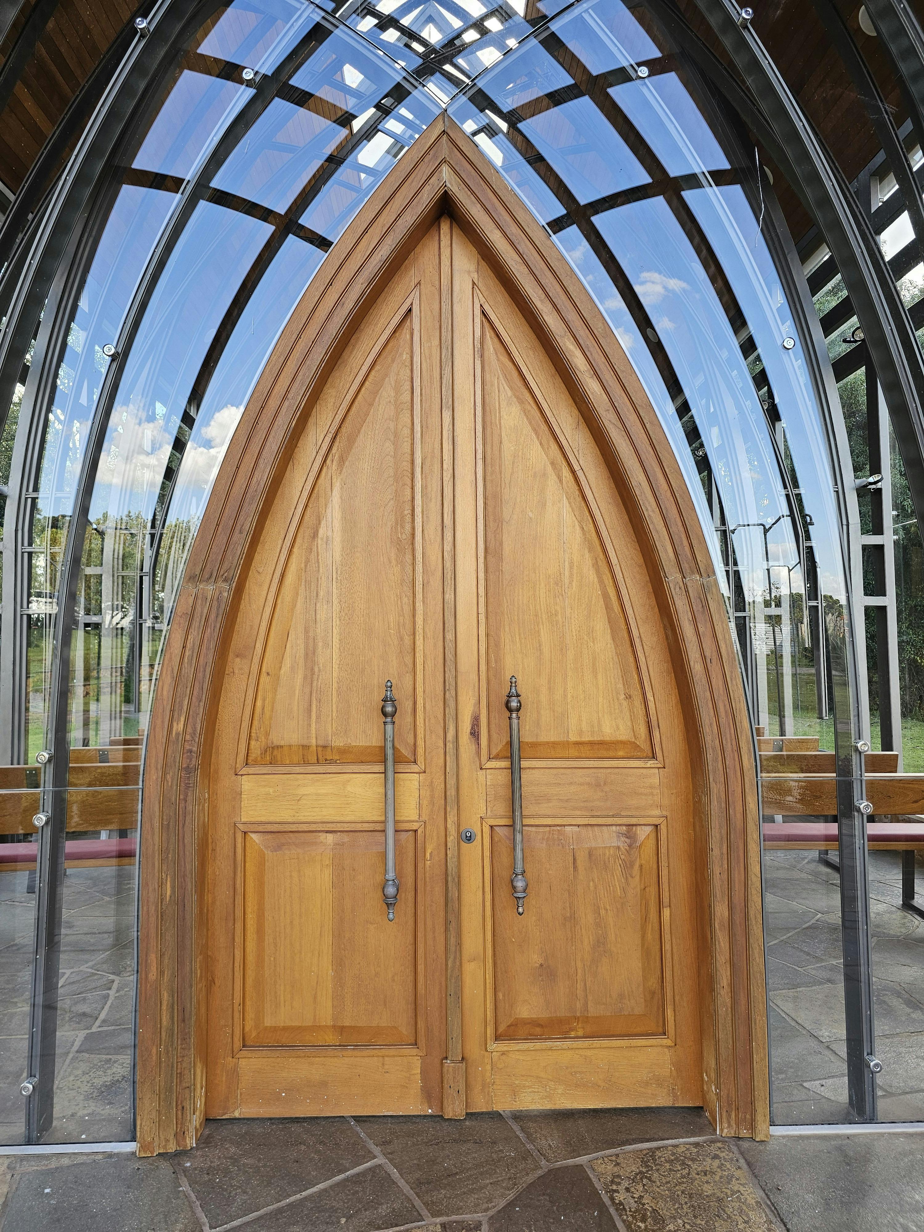 Wooden Chapel Entrance with Glass Arch Design · Free Stock Photo