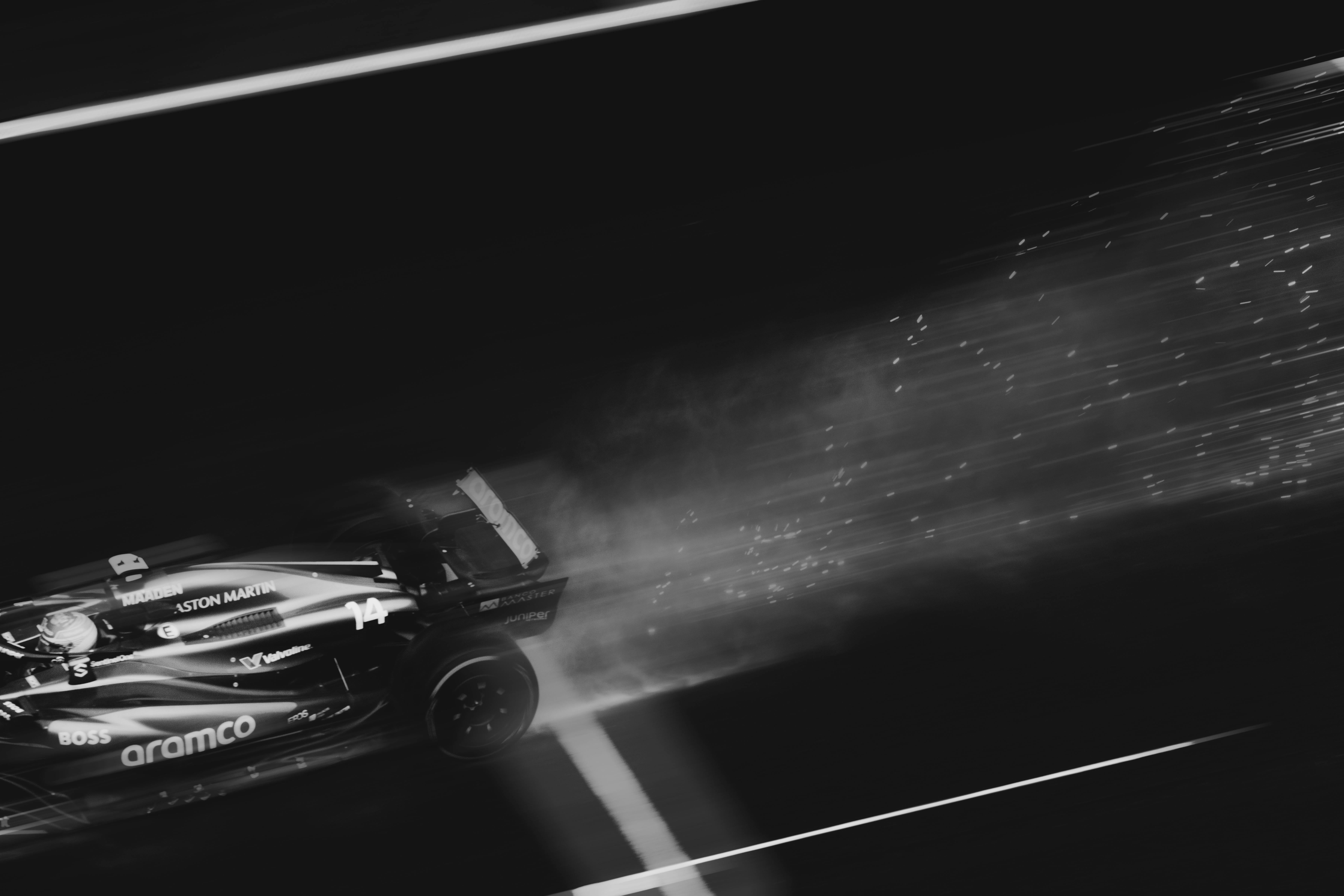 Dynamic Black and White Racing Car in Motion · Free Stock Photo