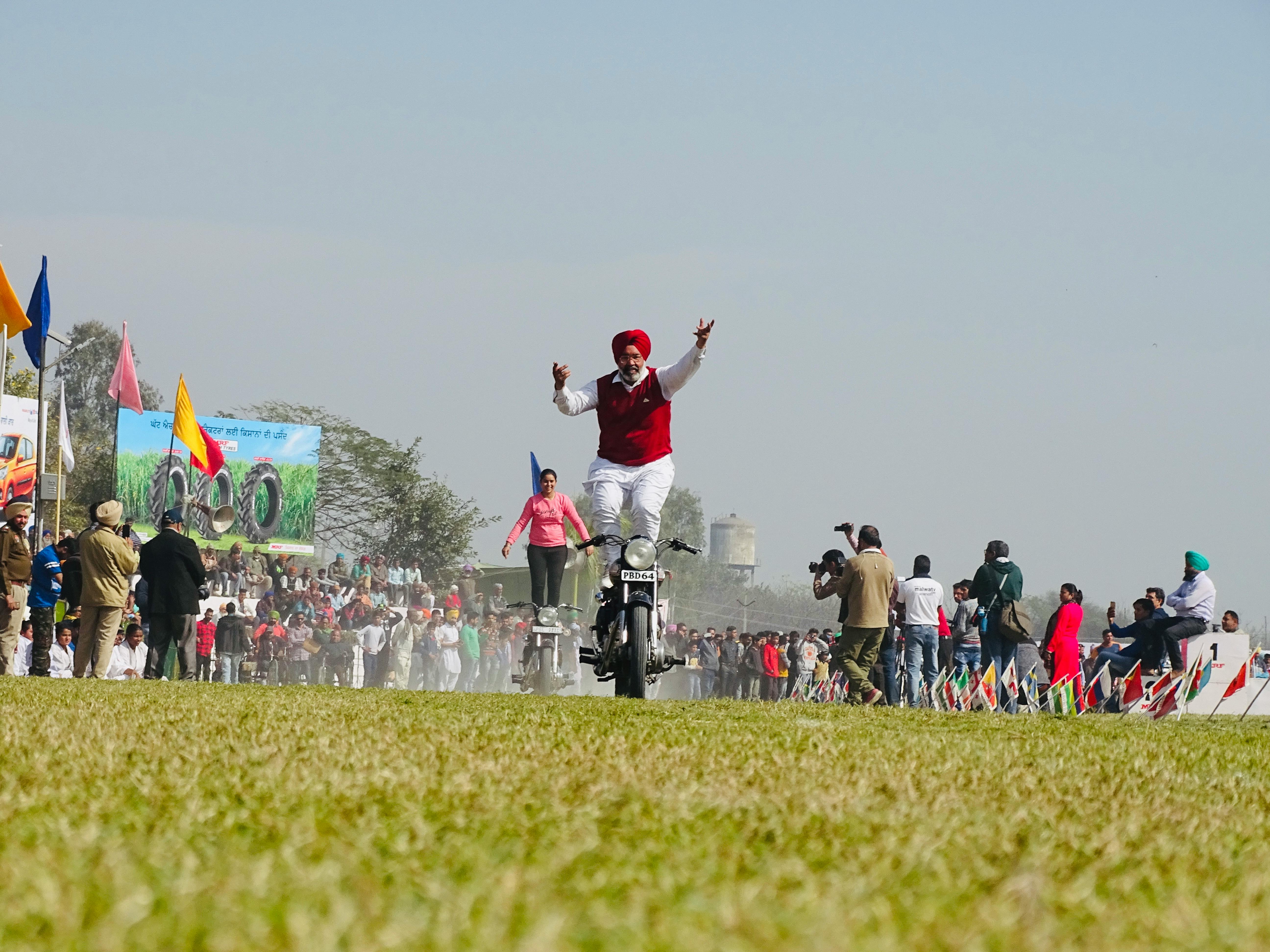 Motorcycle Stunt Performance at Outdoor Event · Free Stock Photo