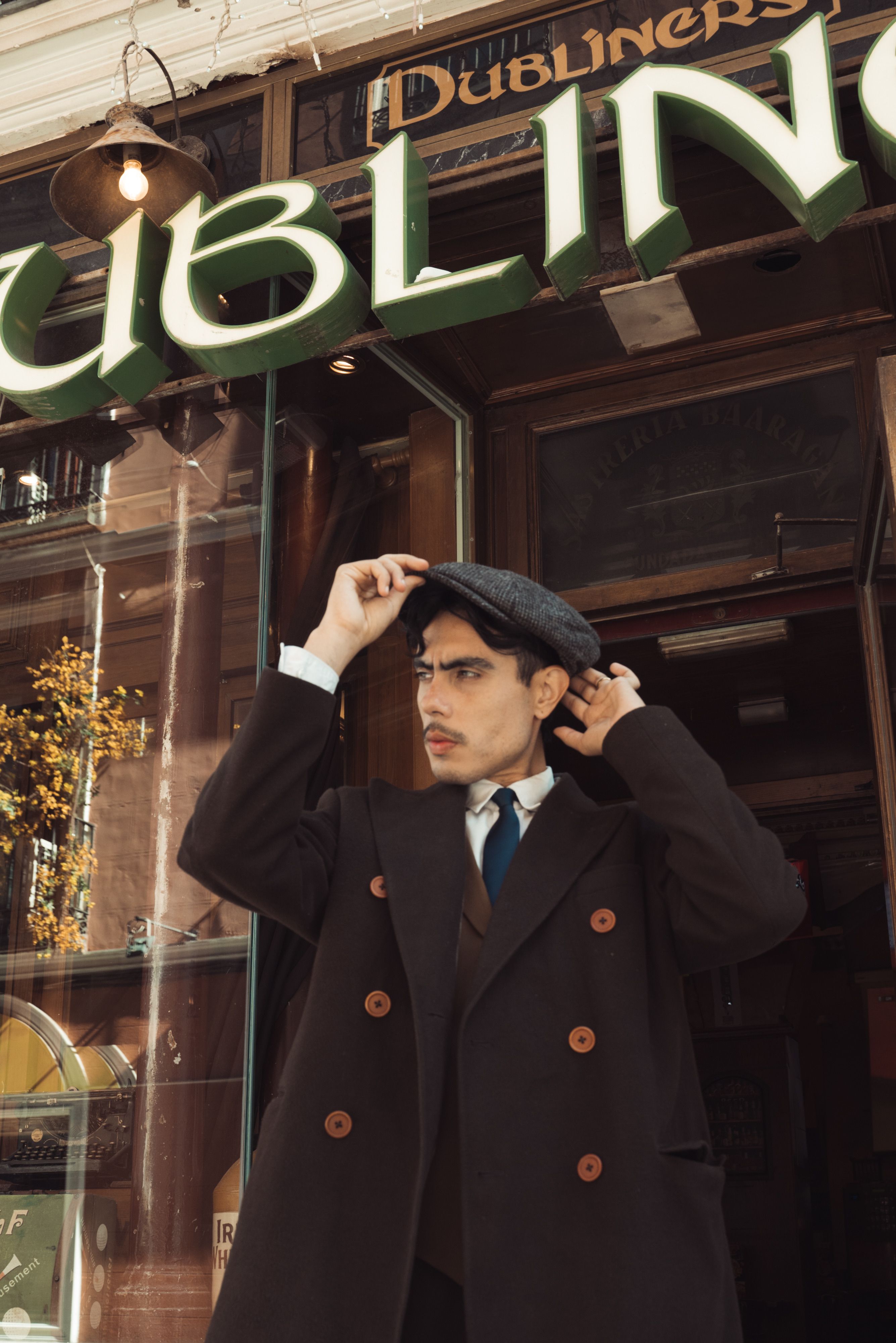 Stylish man in vintage attire outside Dublin pub · Free Stock Photo
