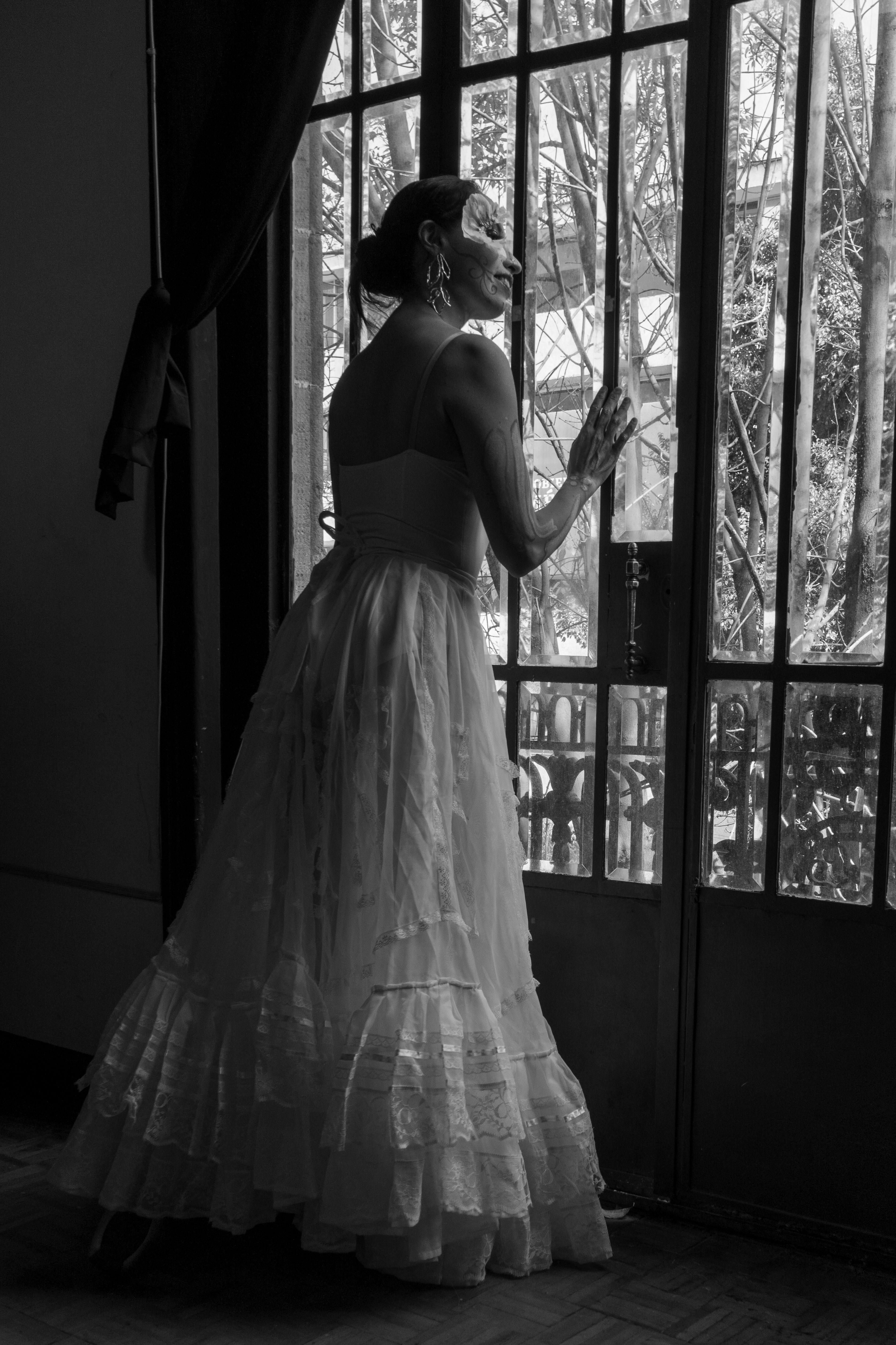 Elegant Ballet Dancer Posing by Window in Mexico · Free Stock Photo