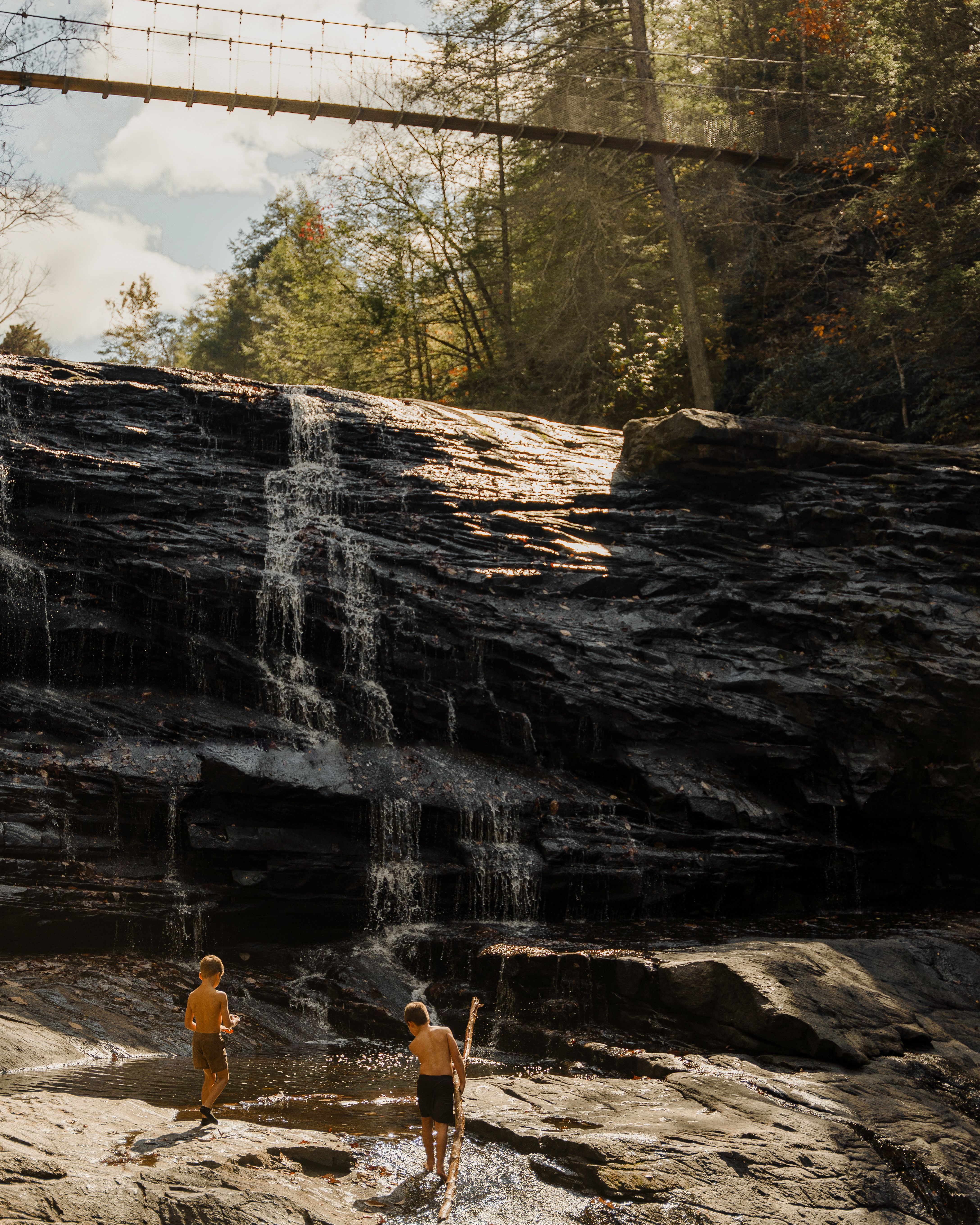 Children Playing at Waterfall in Forest · Free Stock Photo
