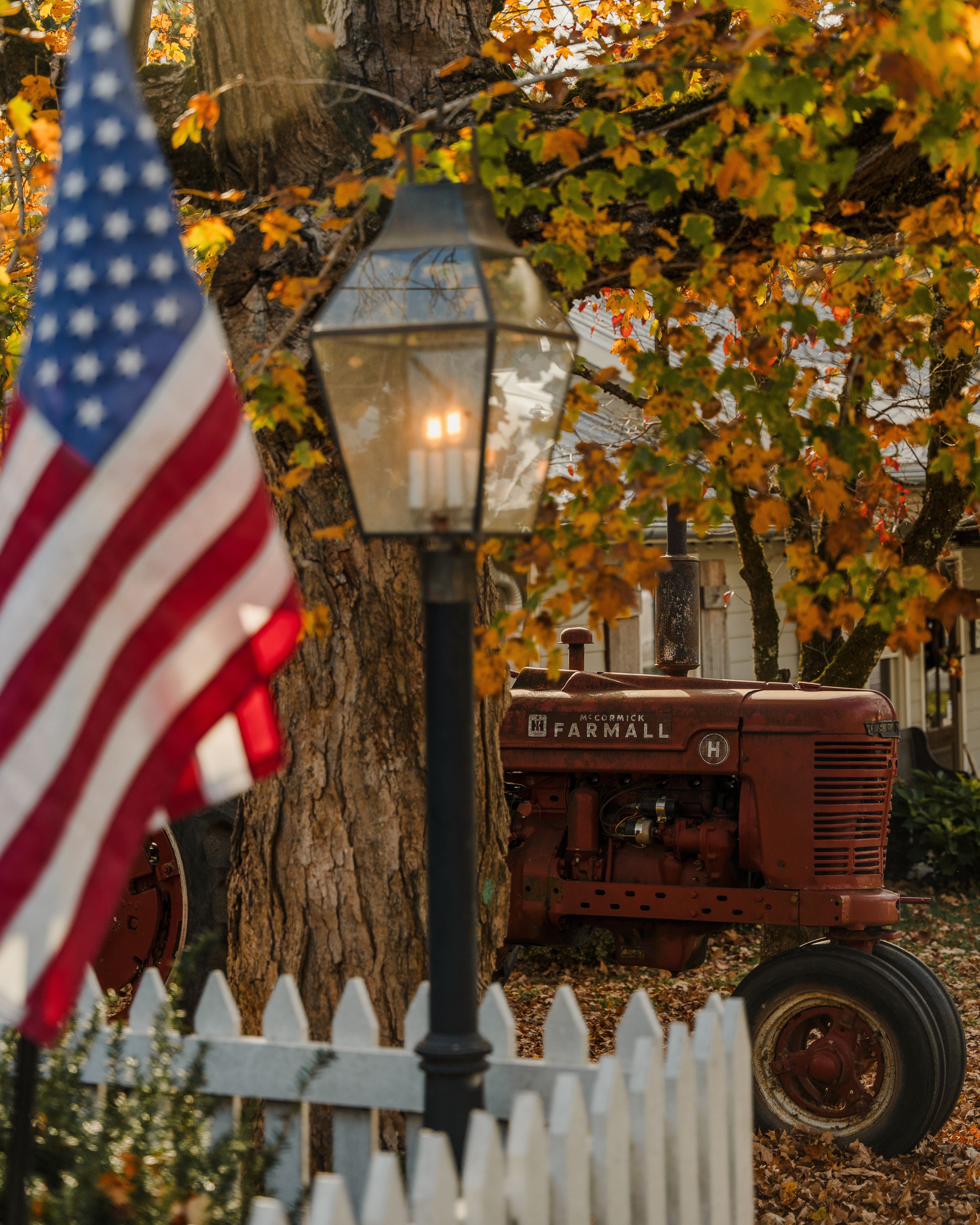 Vintage Tractor and American Flag in Autumn · Free Stock Photo