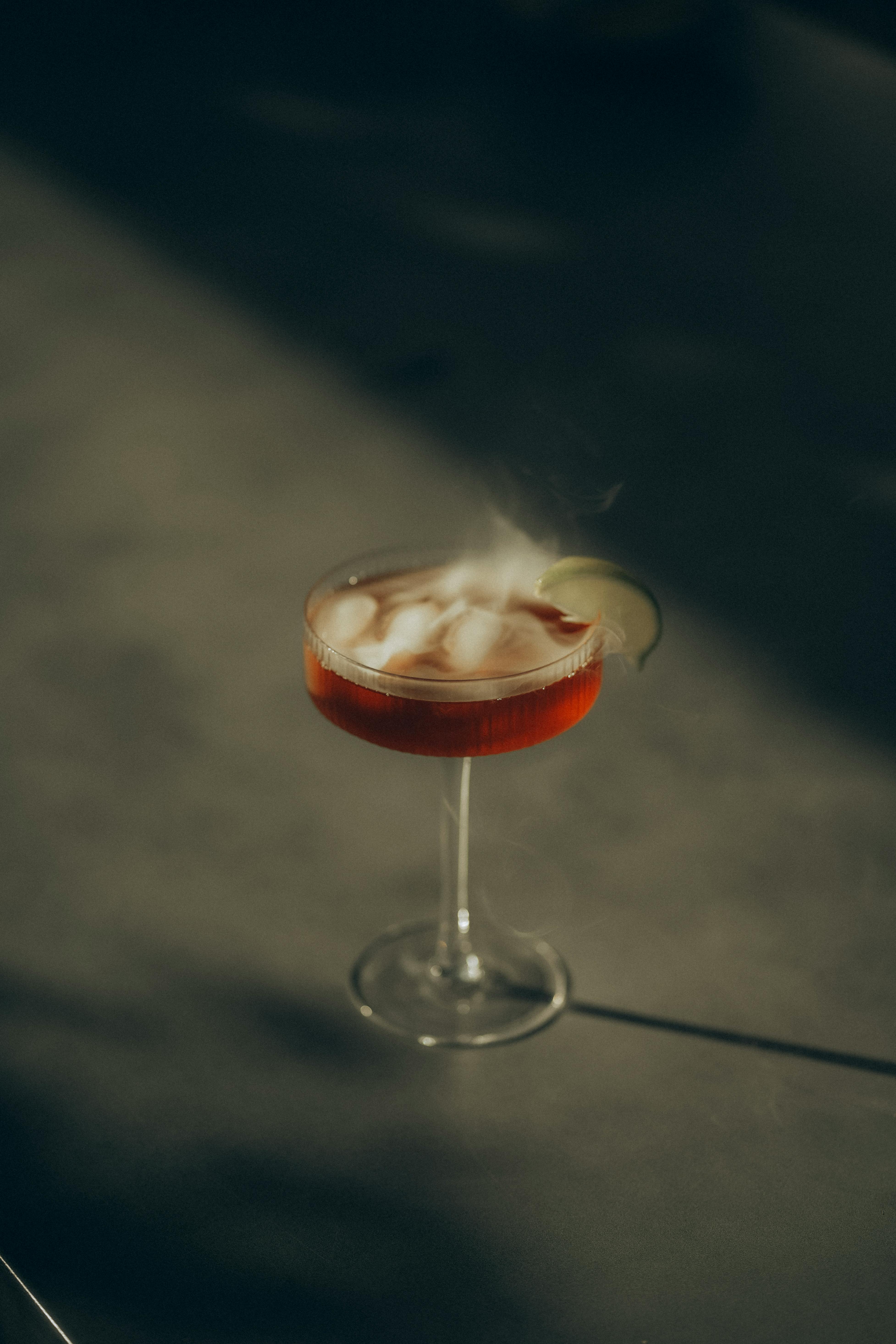 Steaming Cocktail Glass with Lime Slice · Free Stock Photo