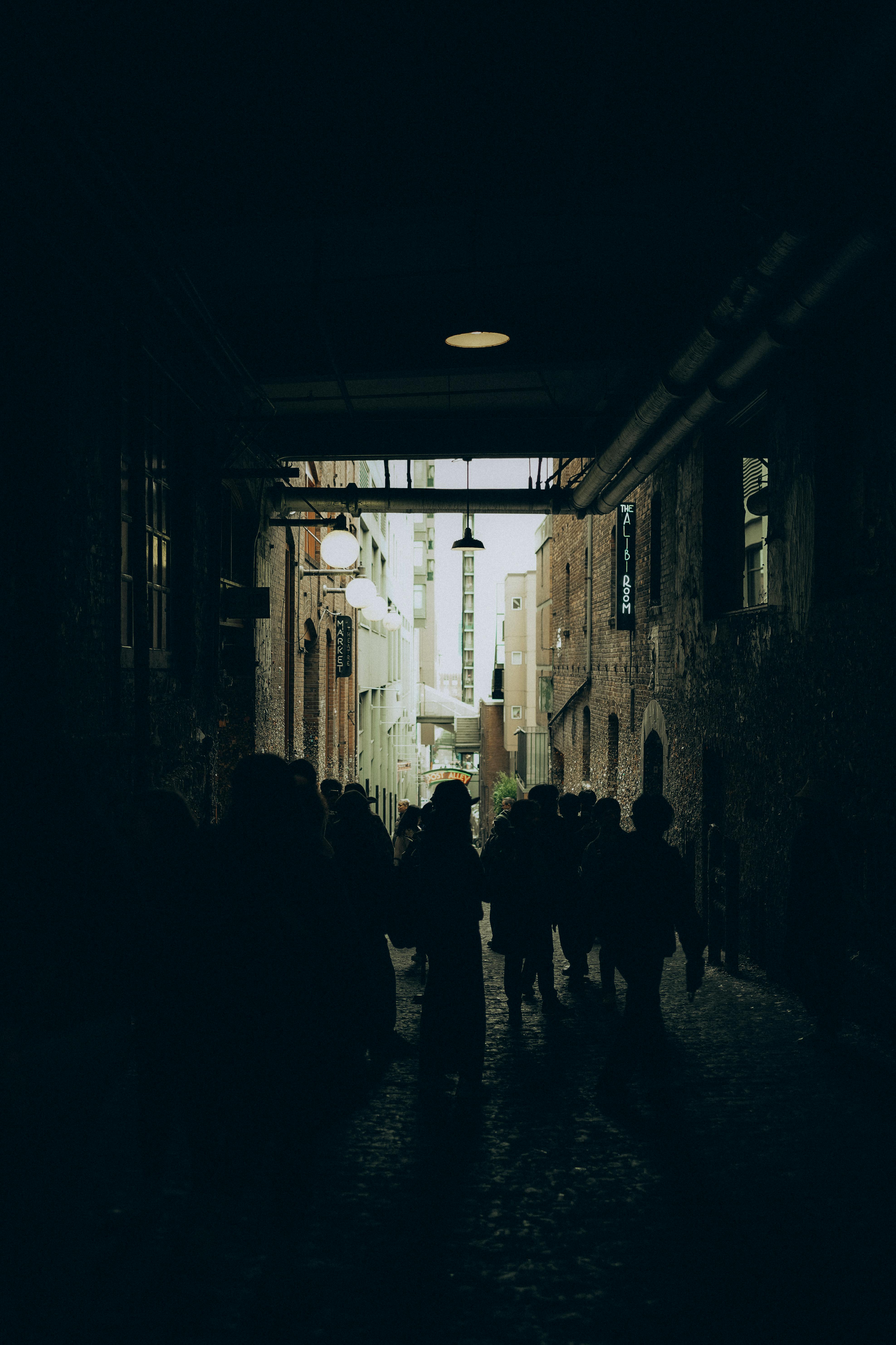 Silhouetted Crowd in Seattle's Historic Alleyway · Free Stock Photo