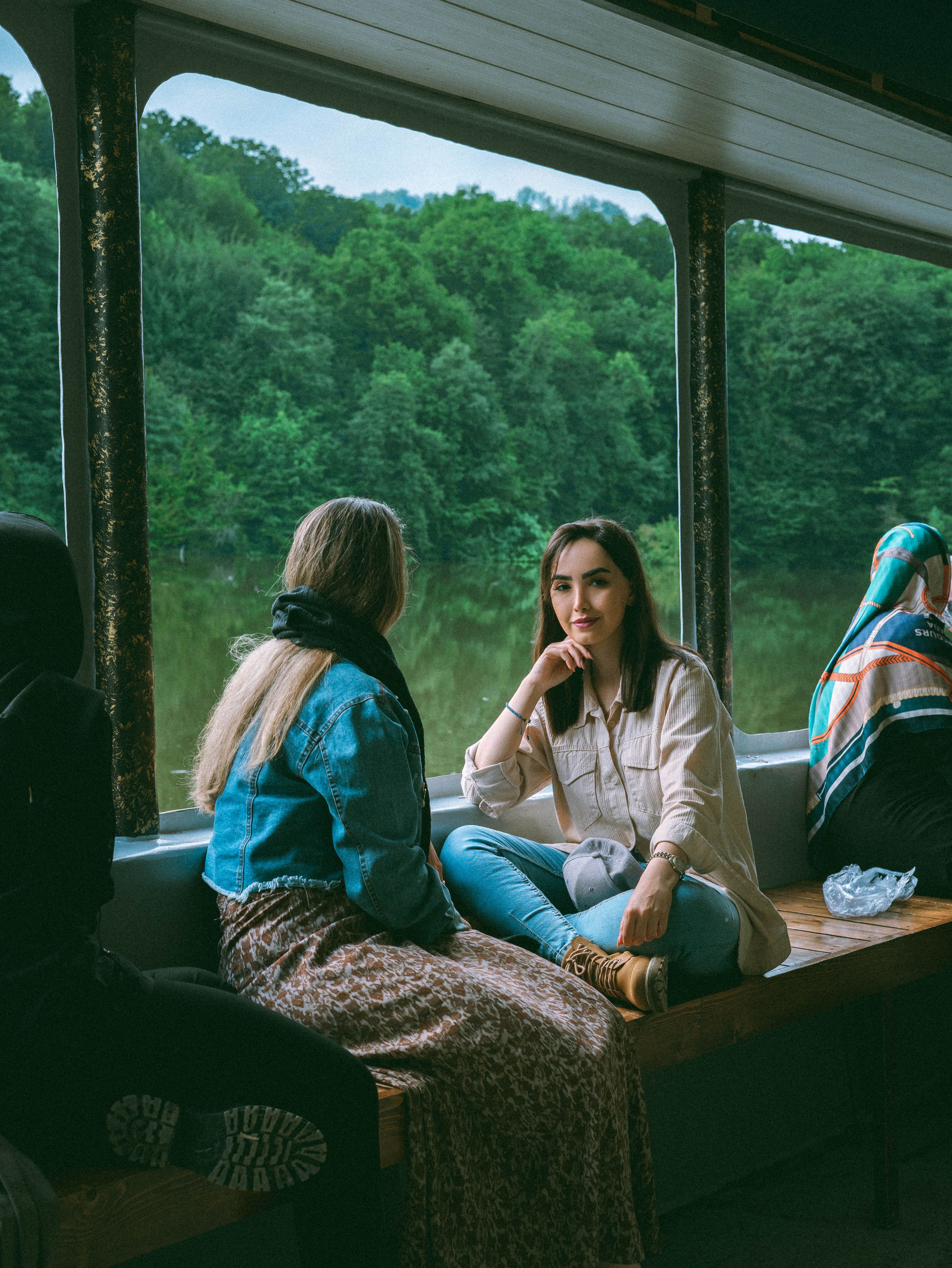 Travelers Enjoy Scenic Train Ride through Nature · Free Stock Photo