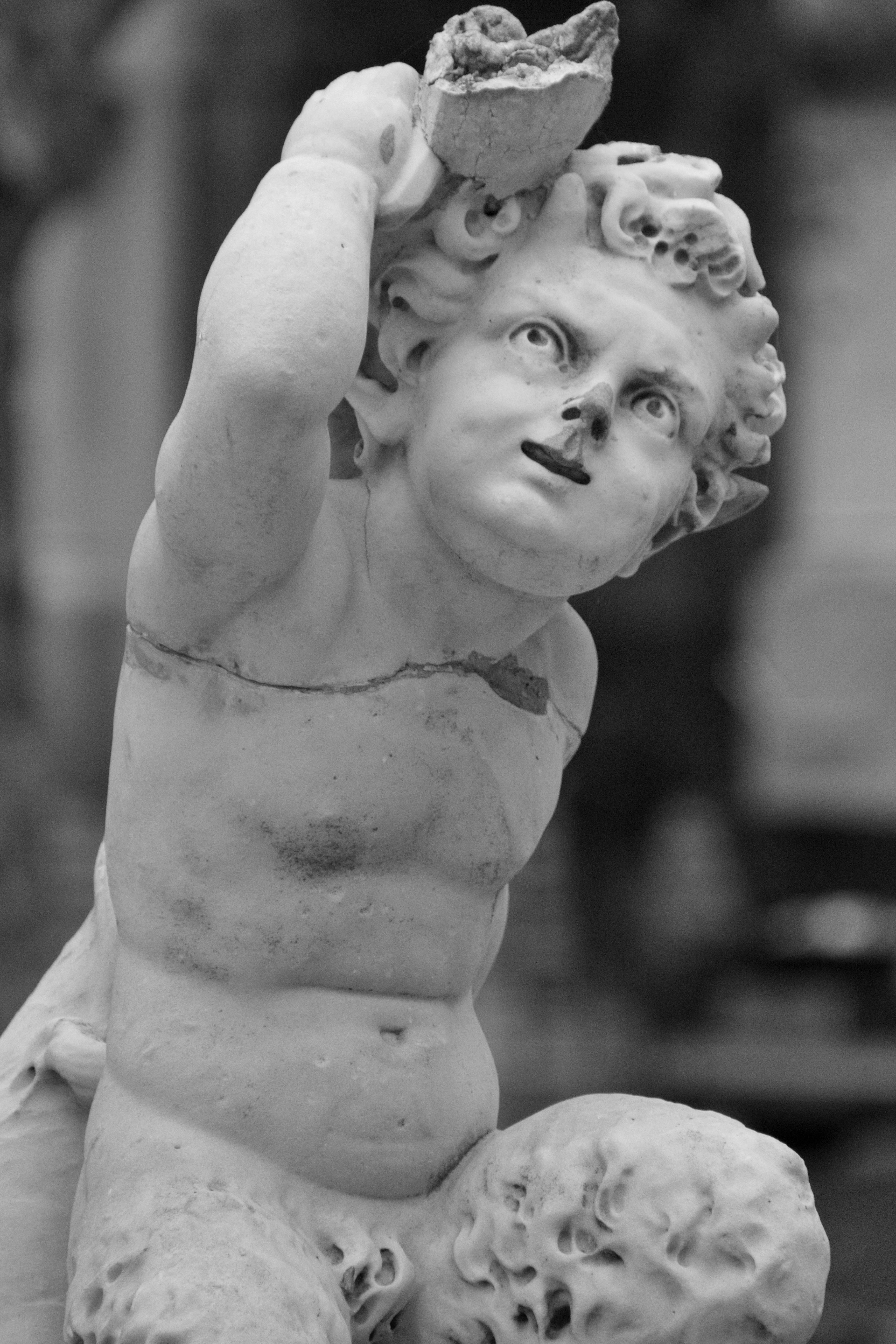 Black and White Statue of Mythical Cherubic Figure · Free Stock Photo