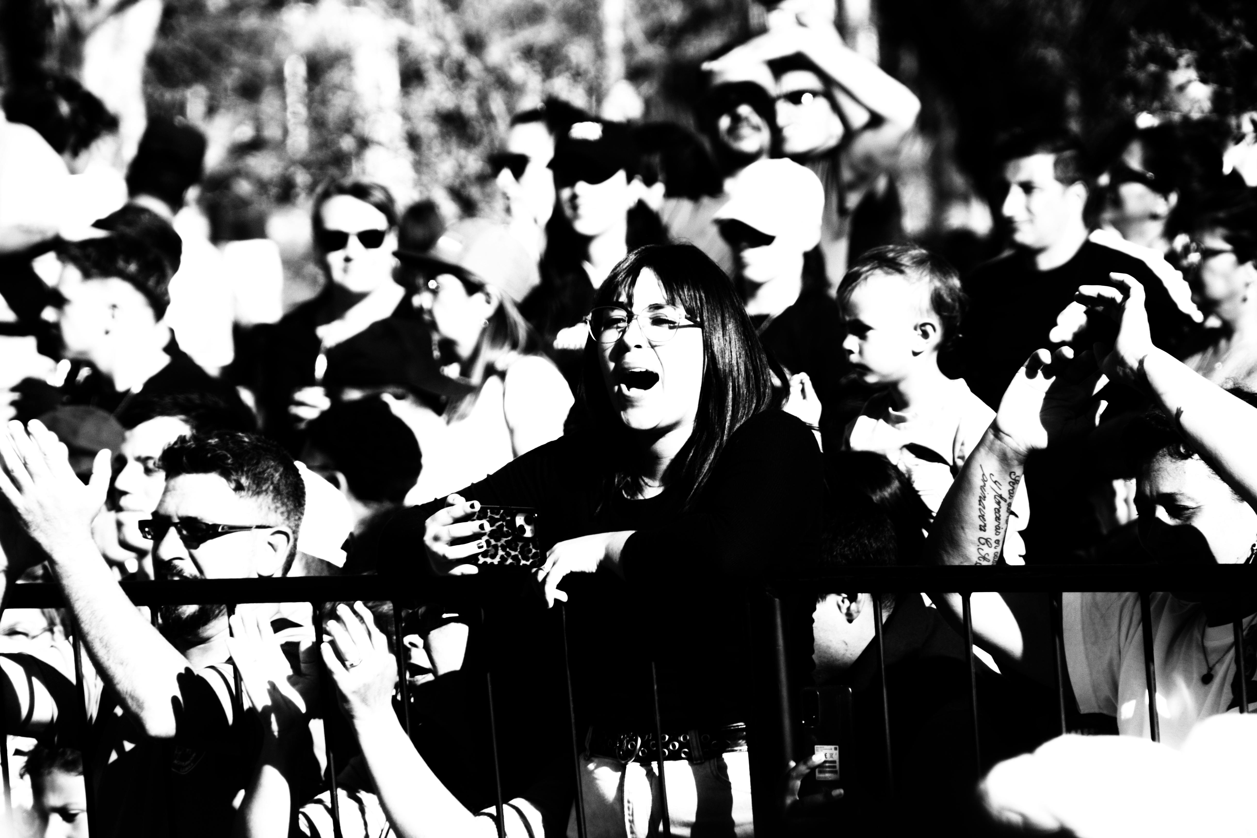 Black and White Crowd Cheering at Outdoor Event · Free Stock Photo