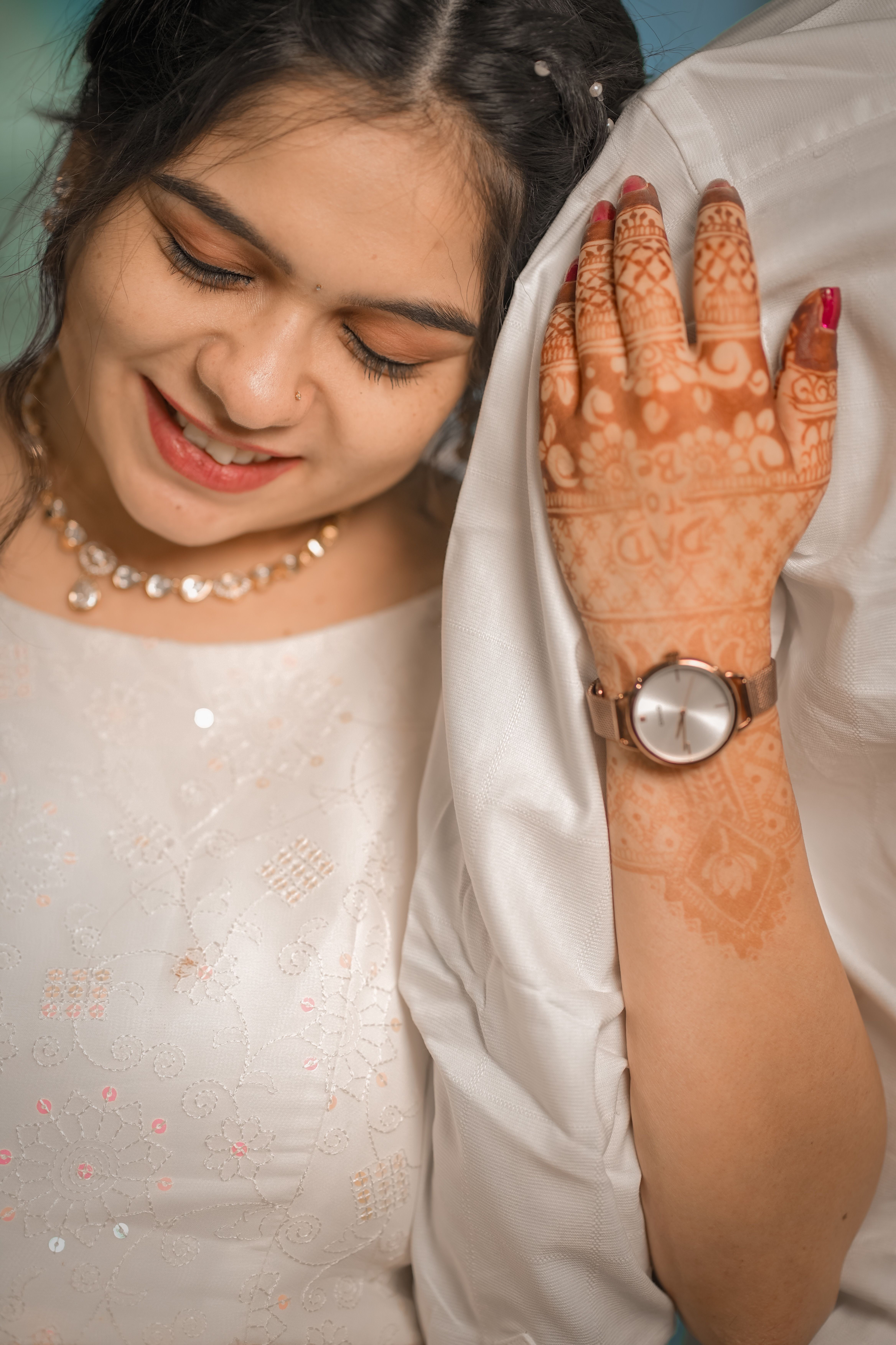 Bride with Henna and Watch Embracing Groom · Free Stock Photo