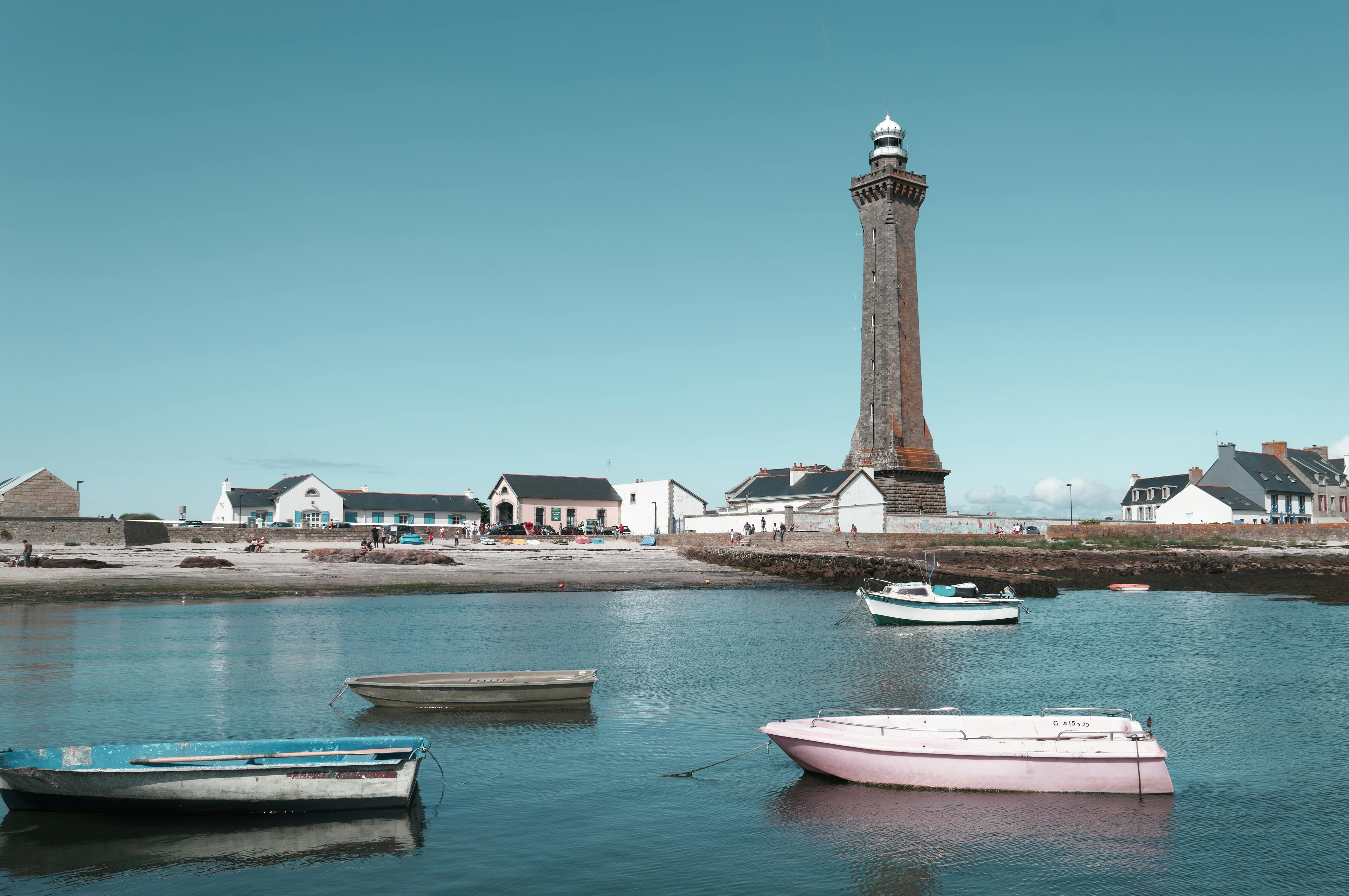Penmarc'h Lighthouse with Boats in Brittany Harbor · Free Stock Photo