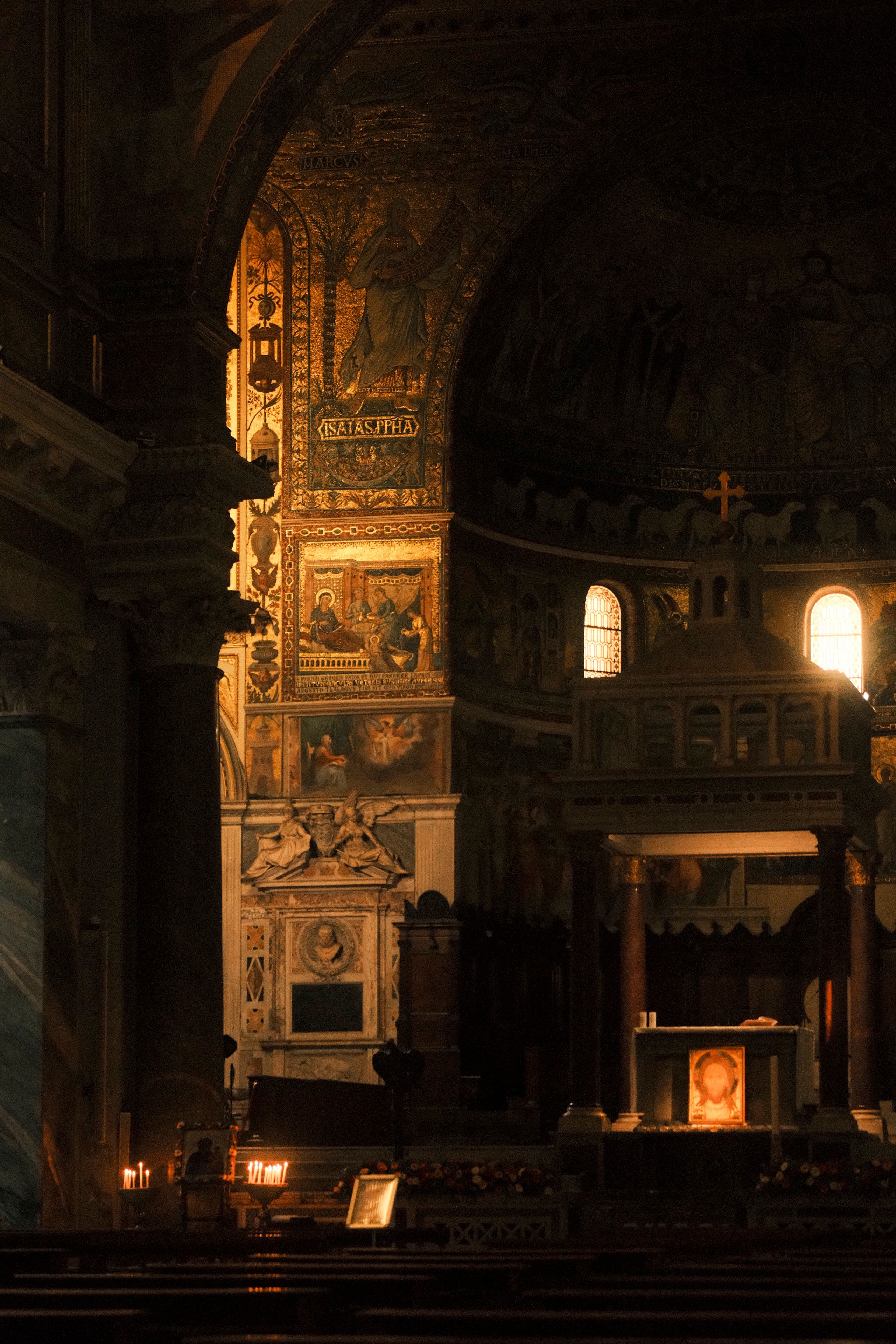 Dimly Lit Historic Church Interior with Candles · Free Stock Photo