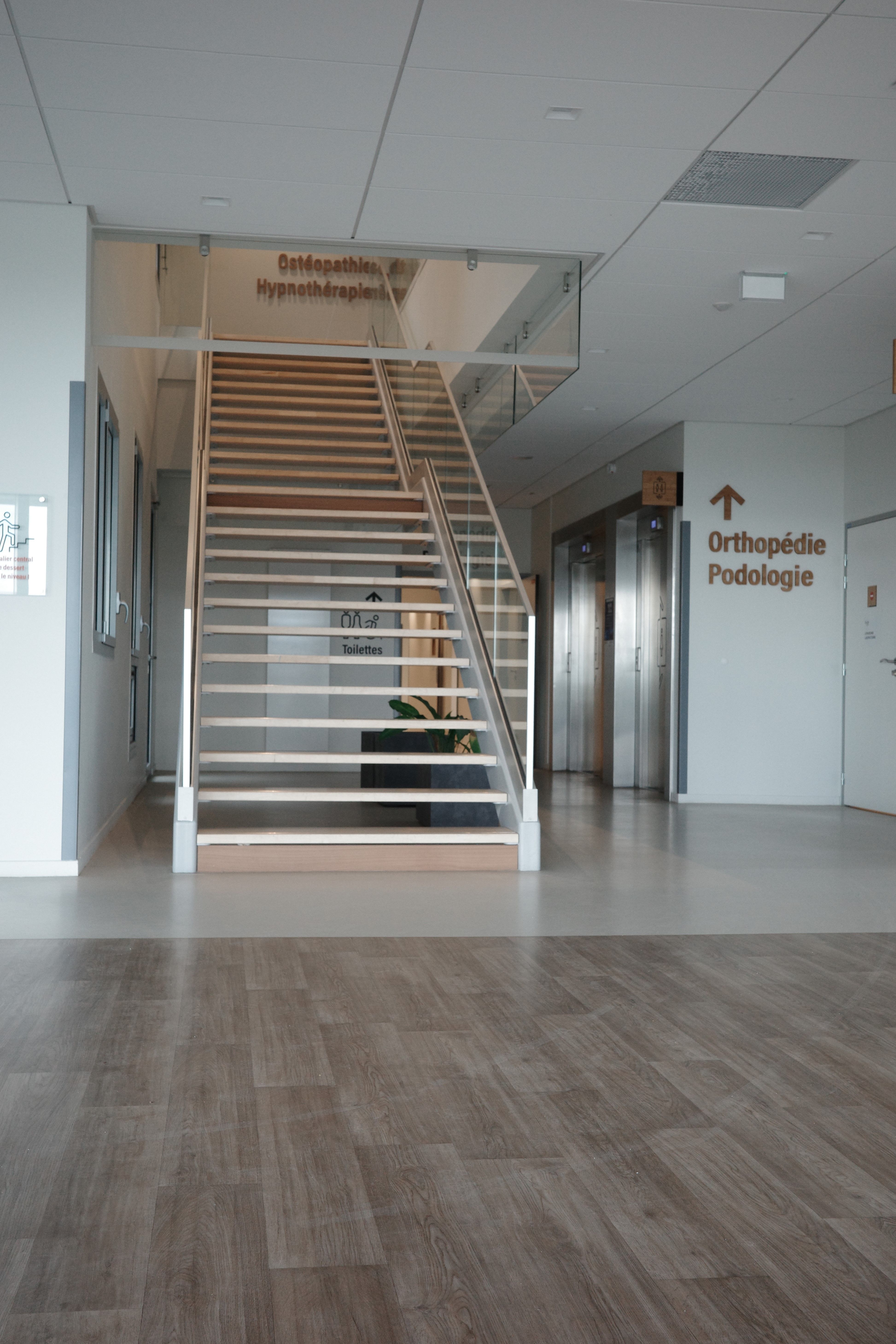 Modern Hospital Interior with Staircase and Elevators · Free Stock Photo