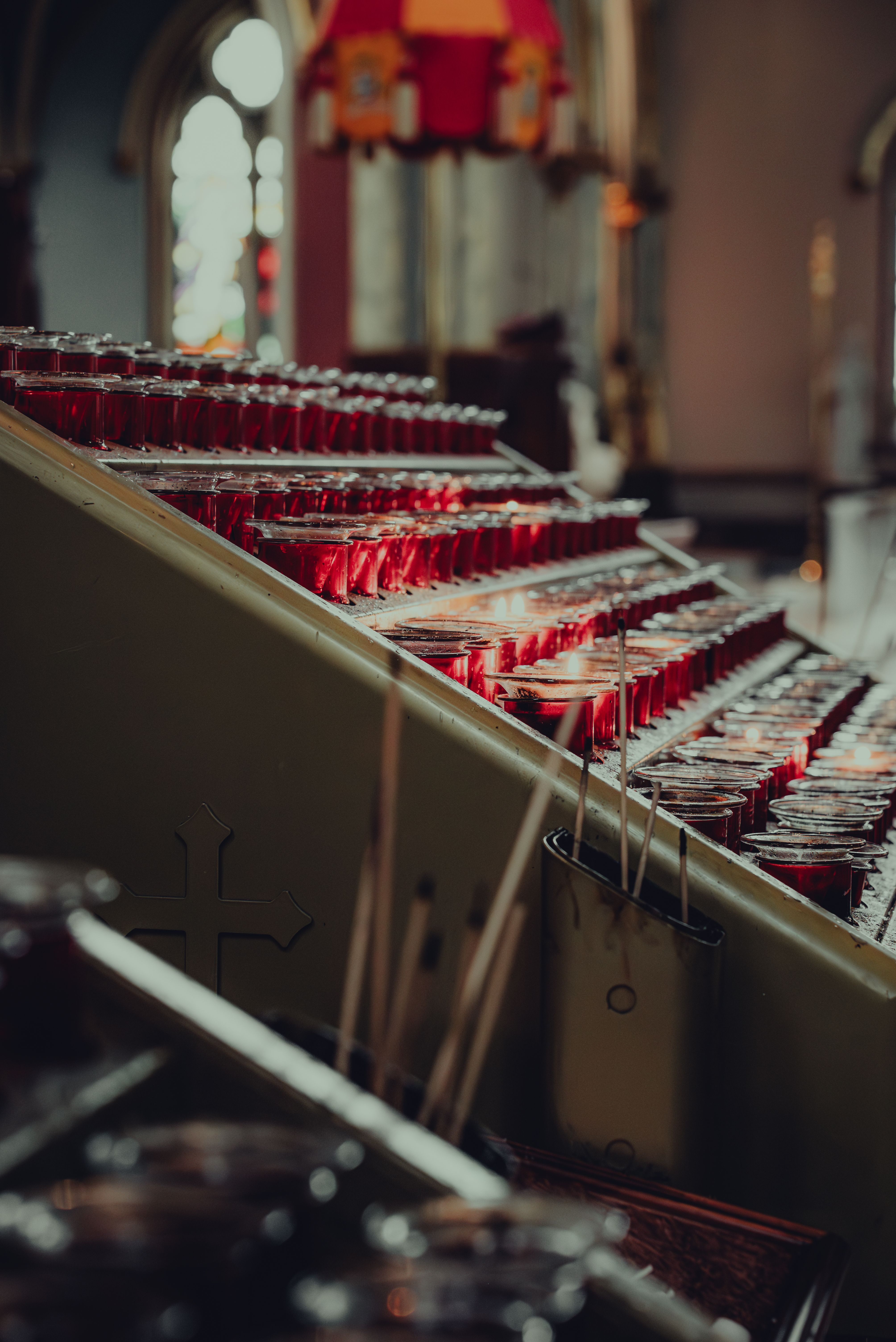 Rows of Lit Candles Inside a Historic Church · Free Stock Photo
