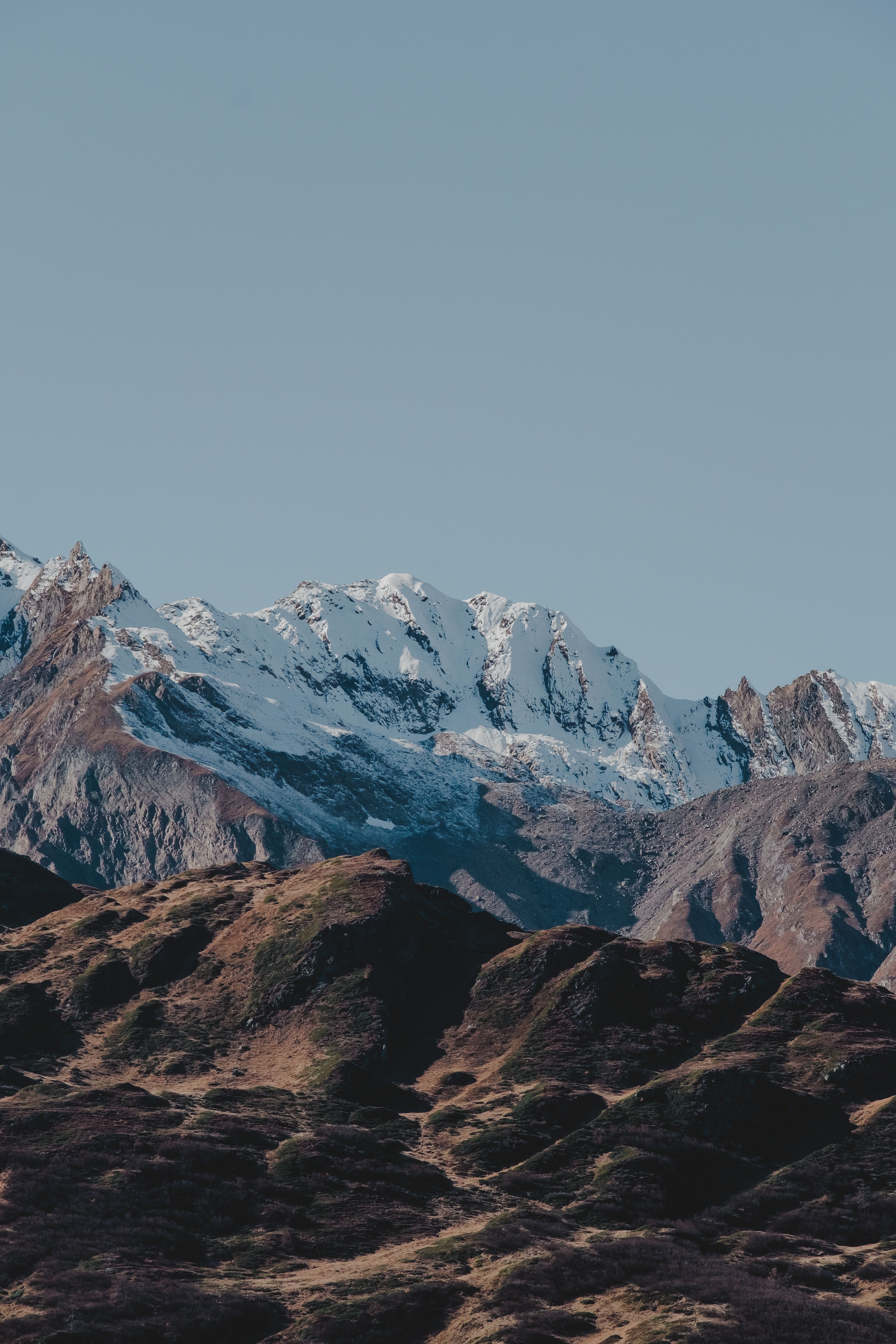 Snowy Mountain Peaks Under Clear Blue Sky · Free Stock Photo