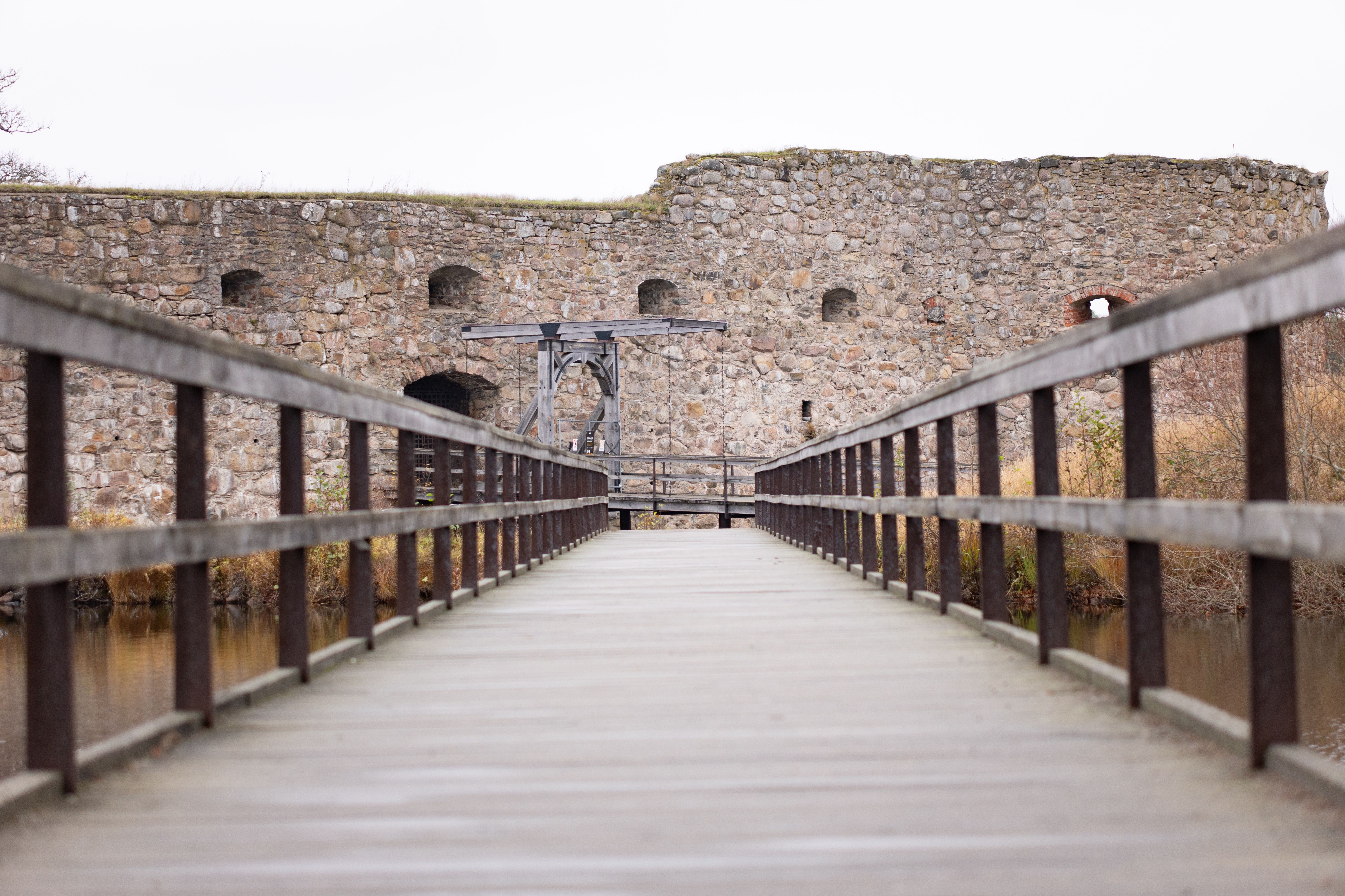 Historic Stone Fort with Wooden Bridge · Free Stock Photo
