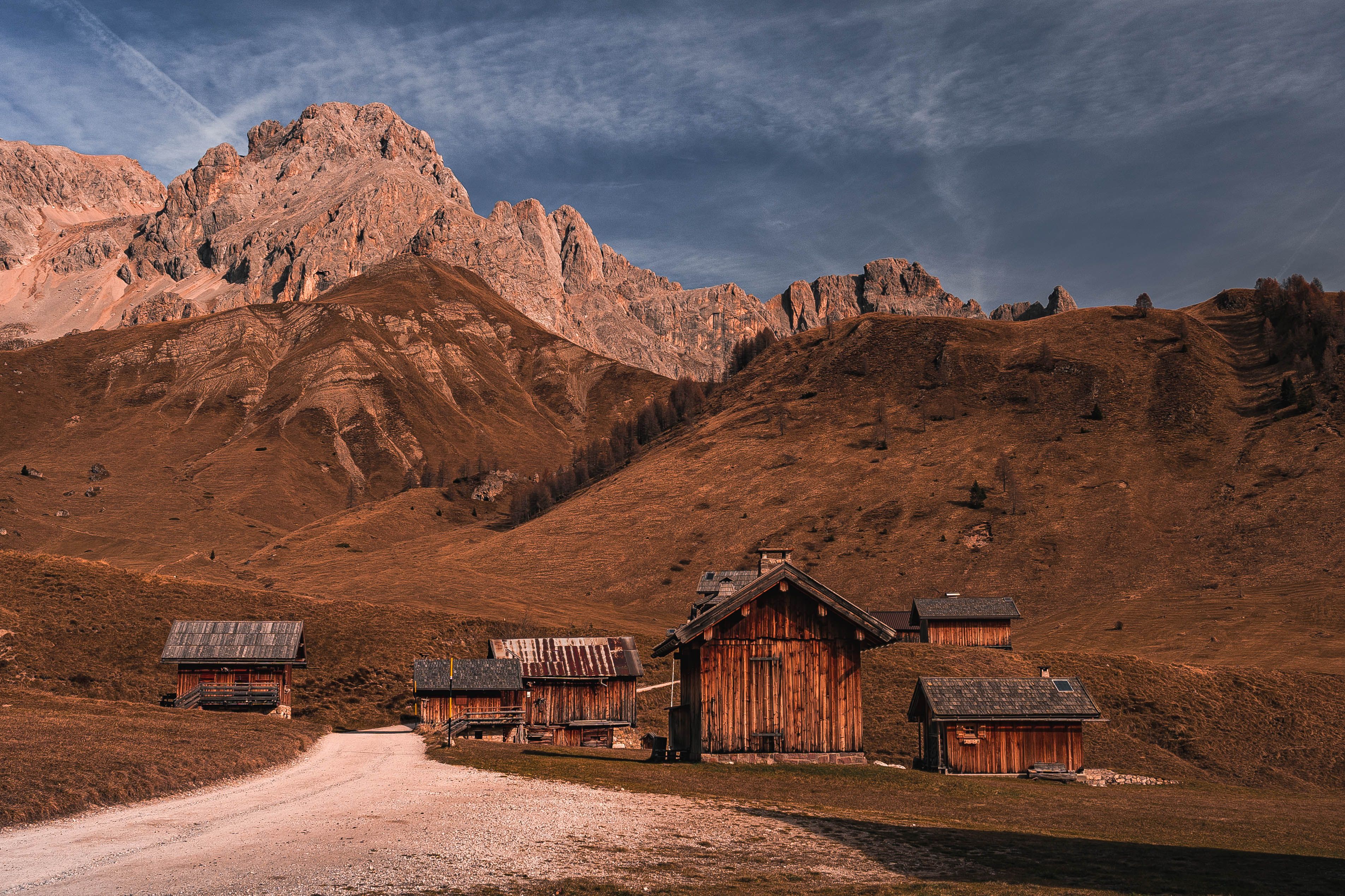 Rustic Alpine Cottages with Mountain Backdrop · Free Stock Photo