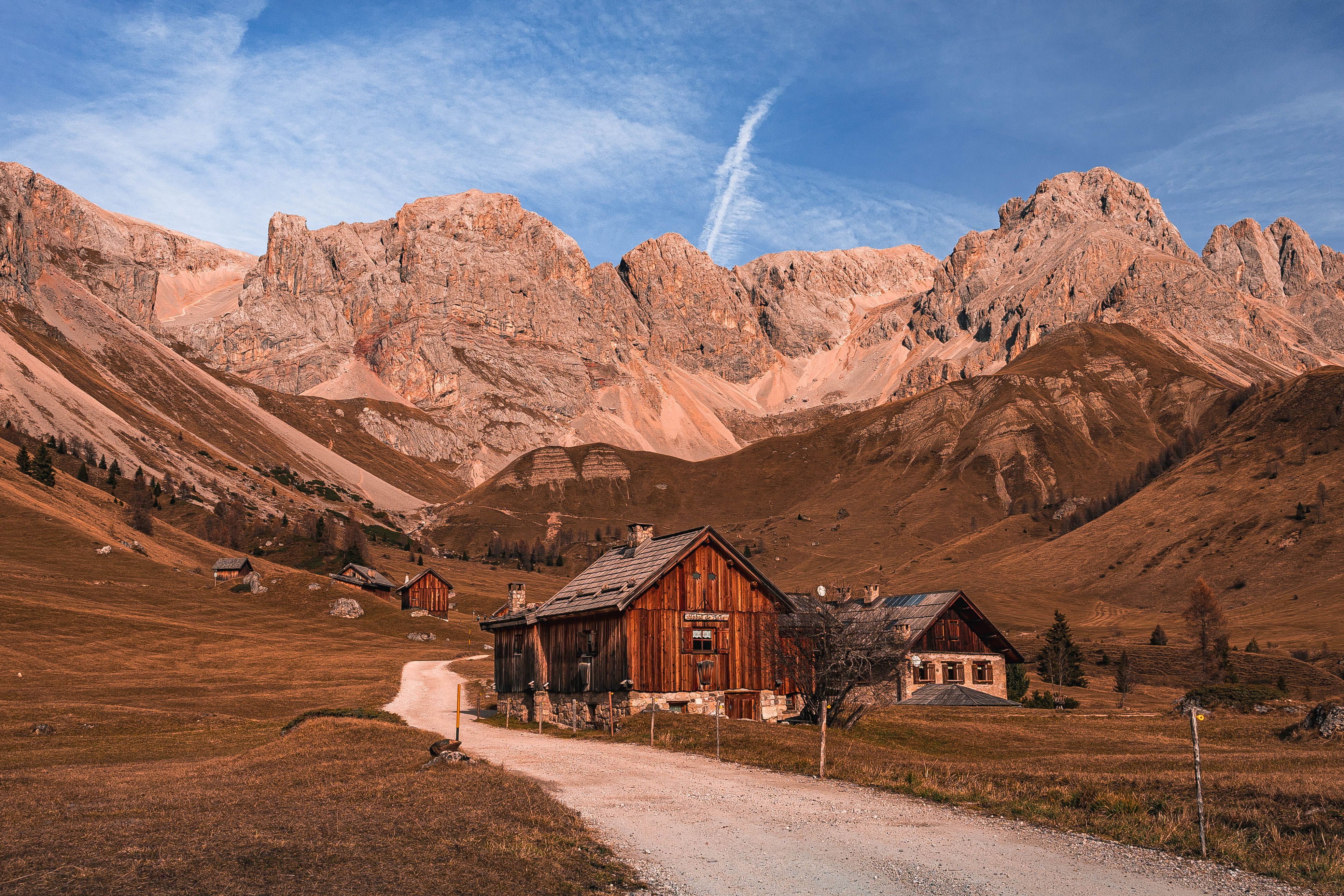 Rustic Cabins Surrounded by Majestic Mountains · Free Stock Photo