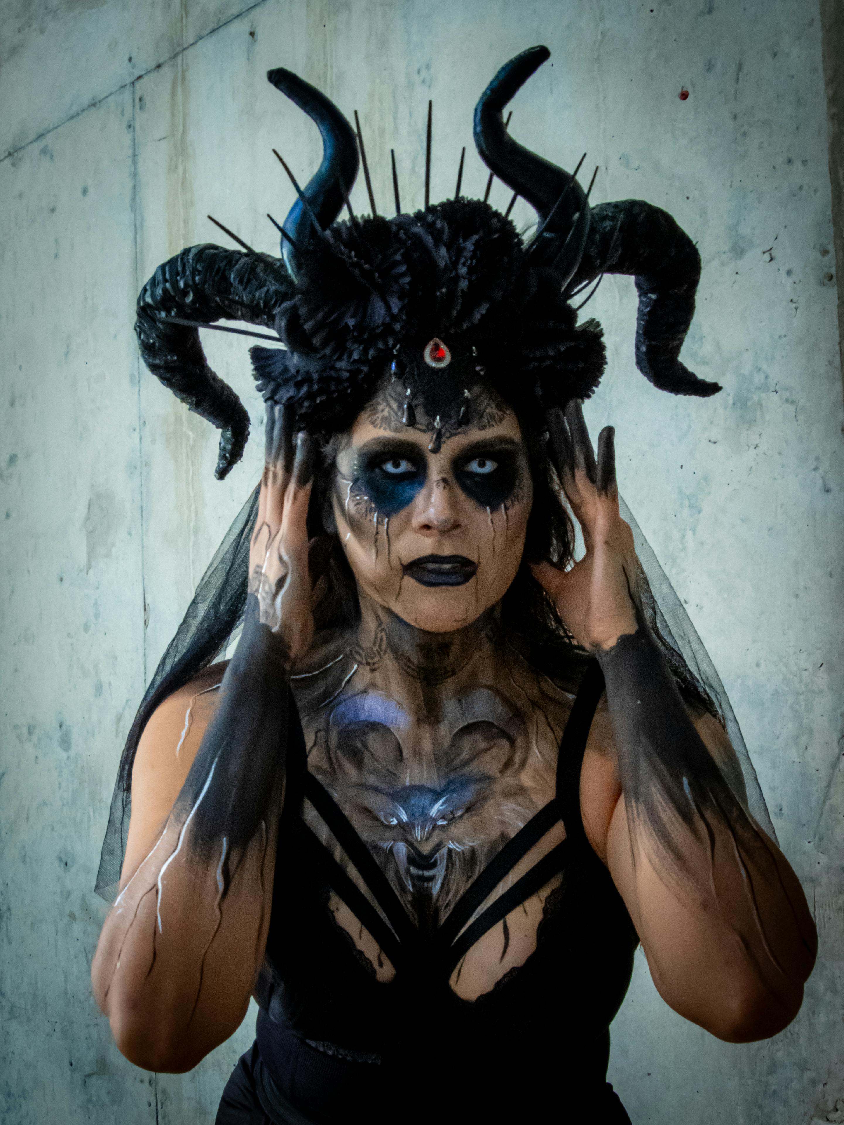 Gothic Demon Costume with Horns and Makeup · Free Stock Photo