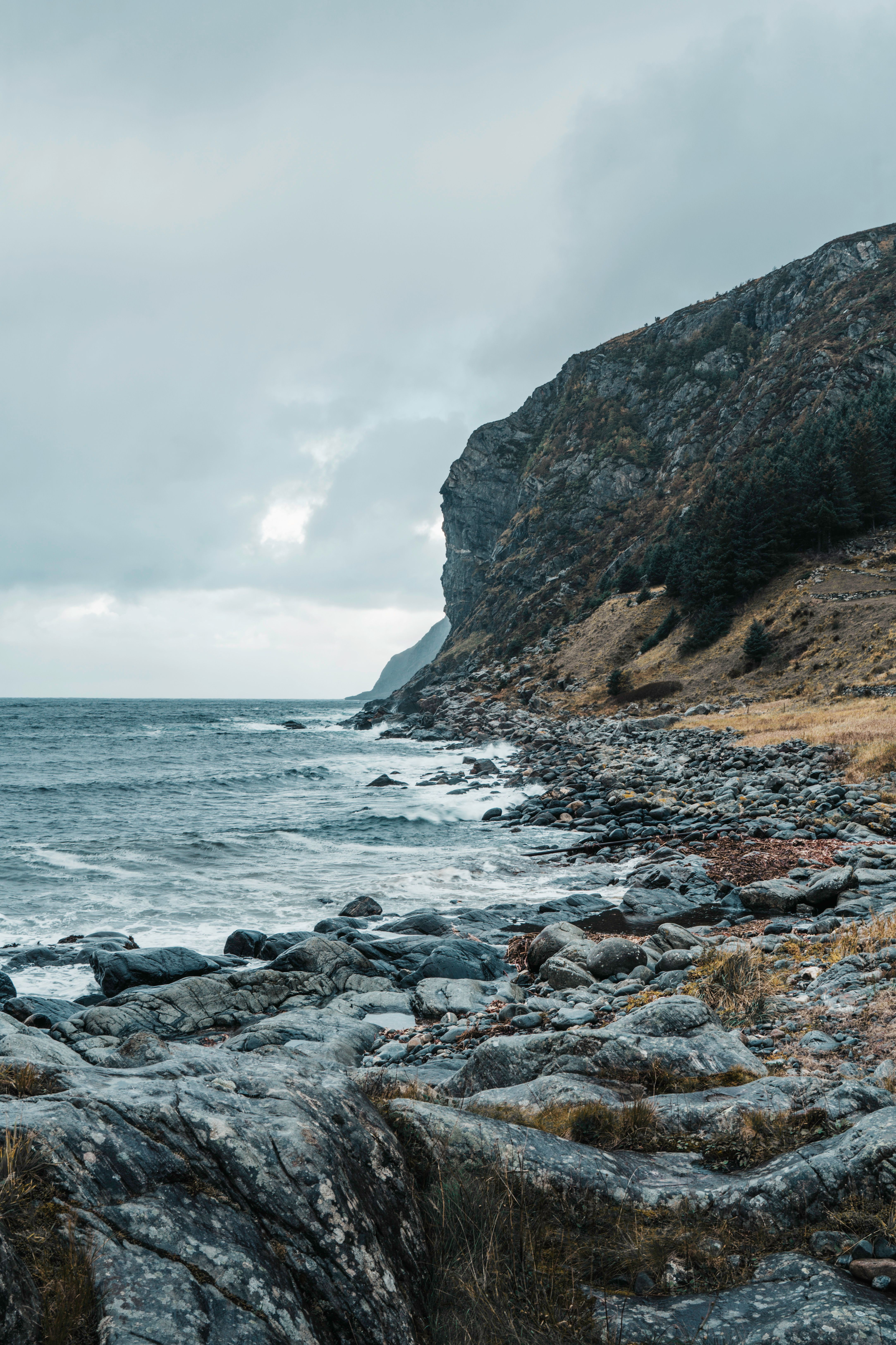 Dramatic Norwegian Coastal Cliffs and Ocean Scene · Free Stock Photo