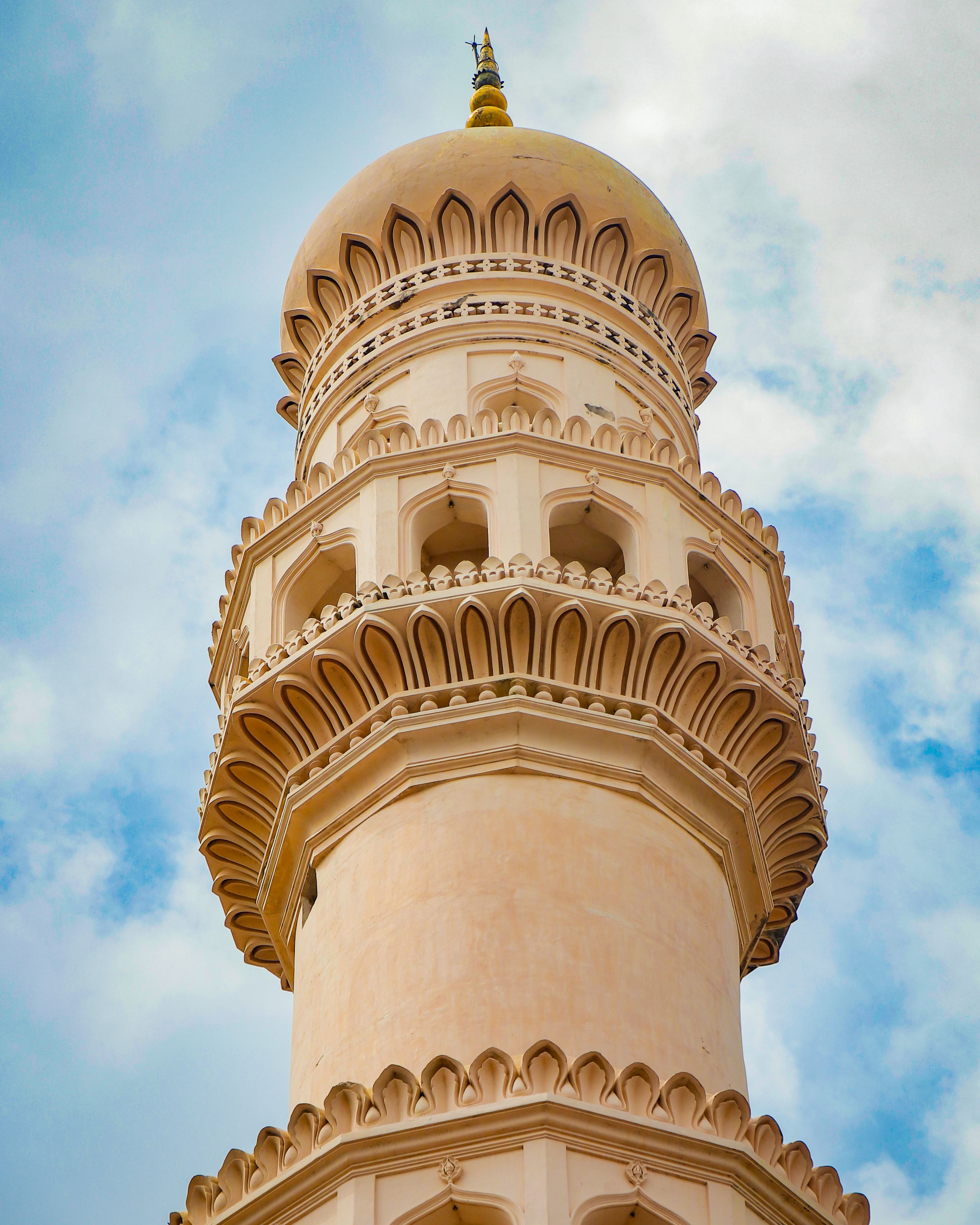 Intricate Minaret Tower Against Blue Sky · Free Stock Photo